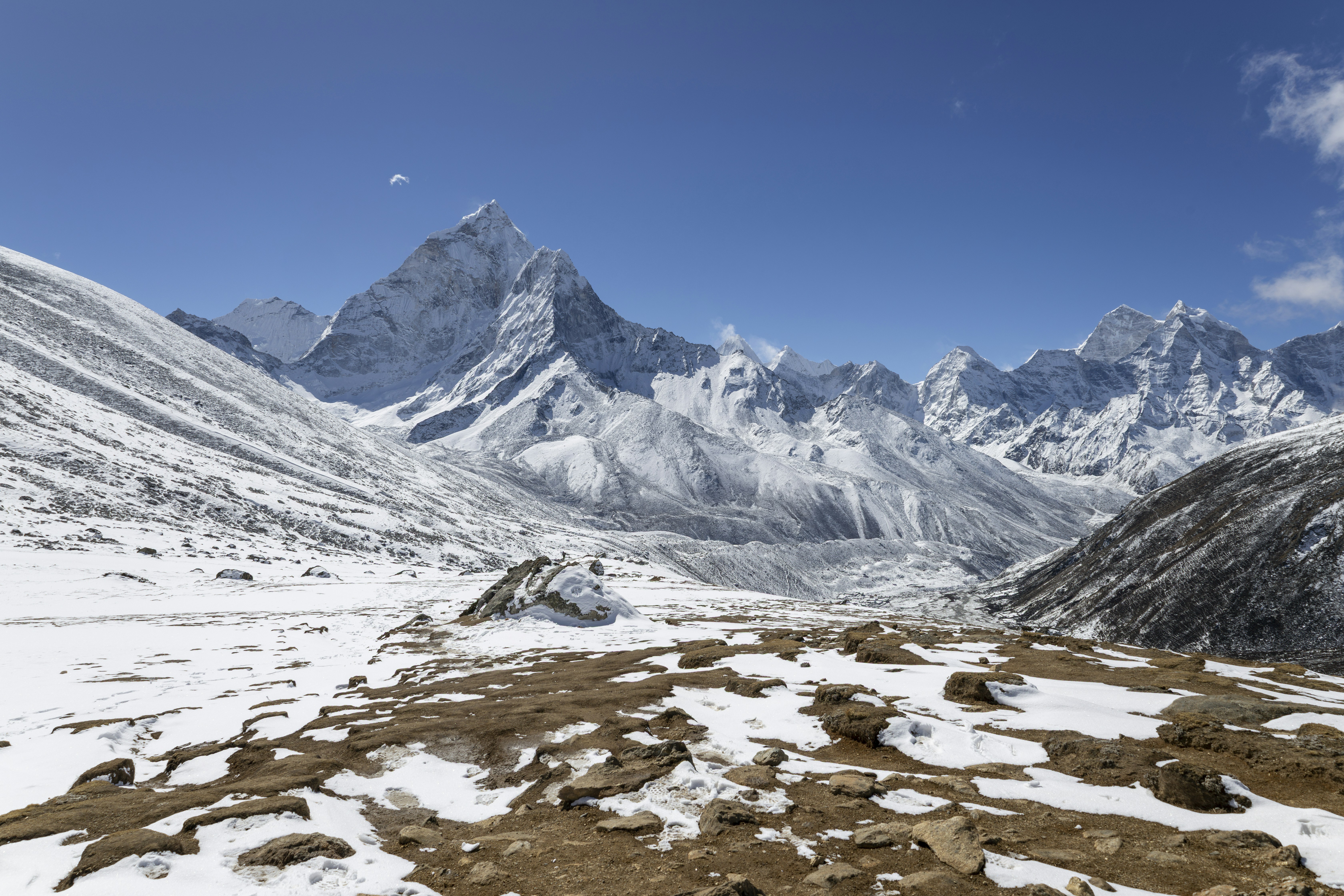 Snowbound Ramparts: A Staircase of Peaks Against a Clear Blueline