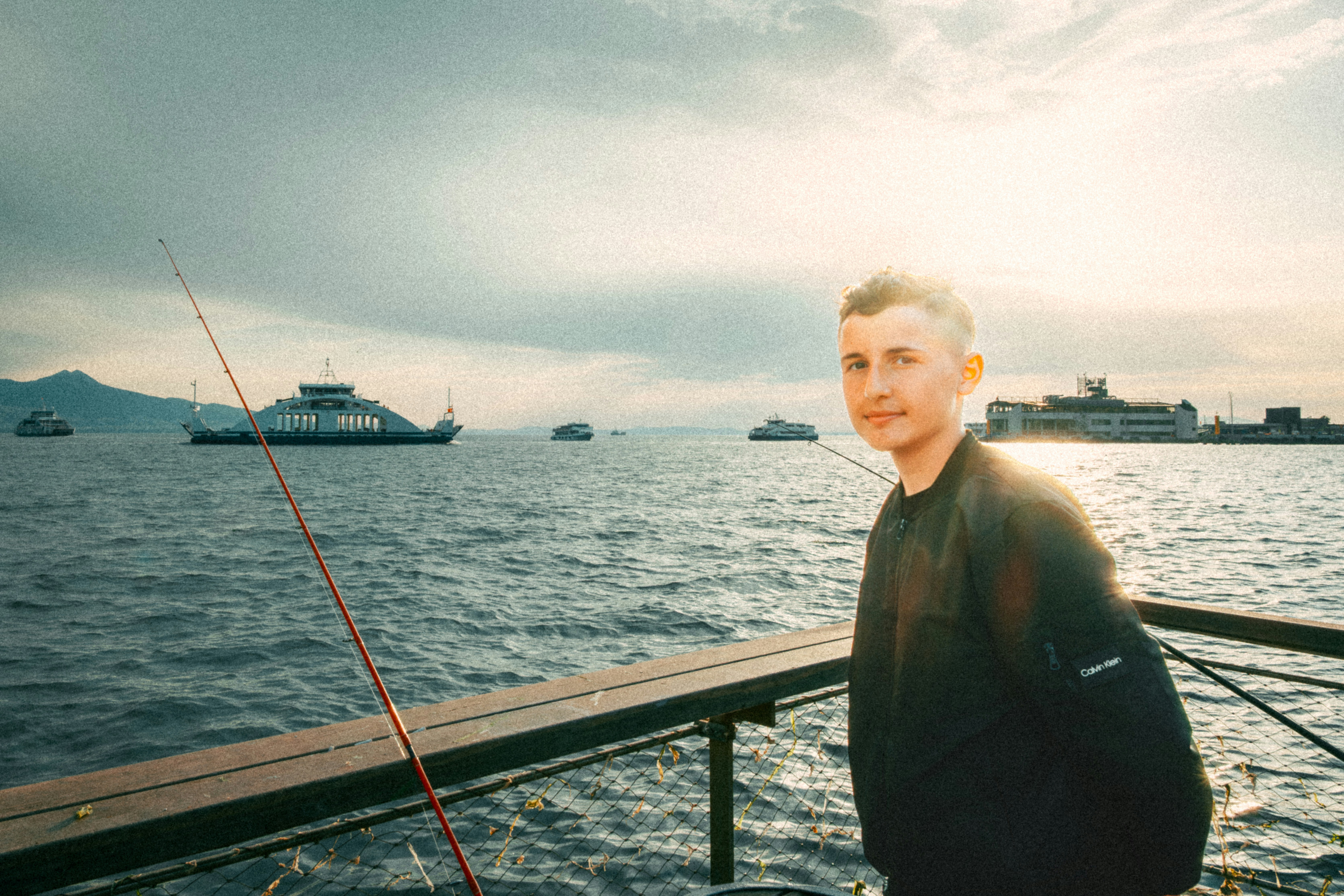 Sunlit Portrait by the Marina: A Quiet Moment with the Waterline