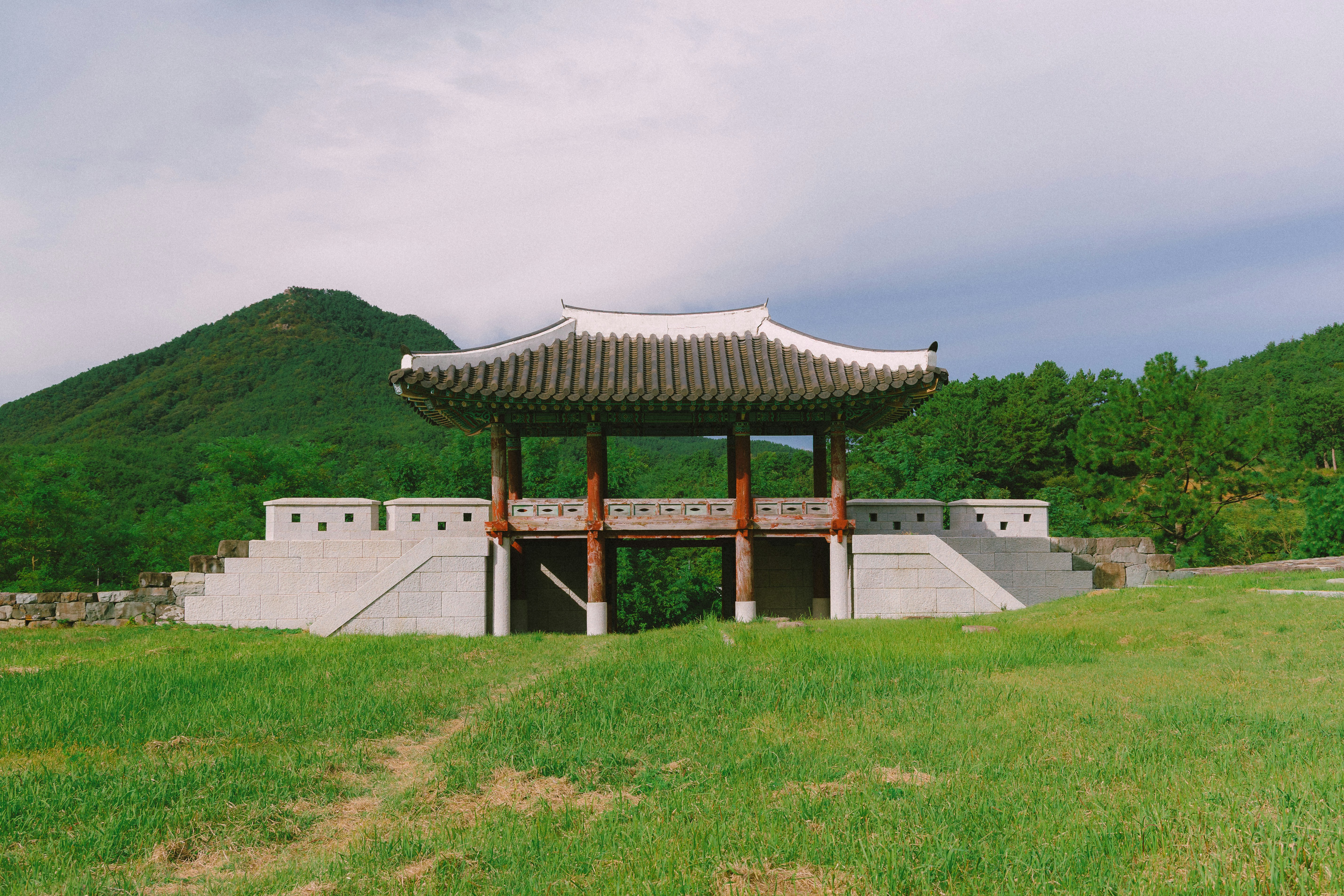 Temple Gate Framed by Rolling Green Surroundings