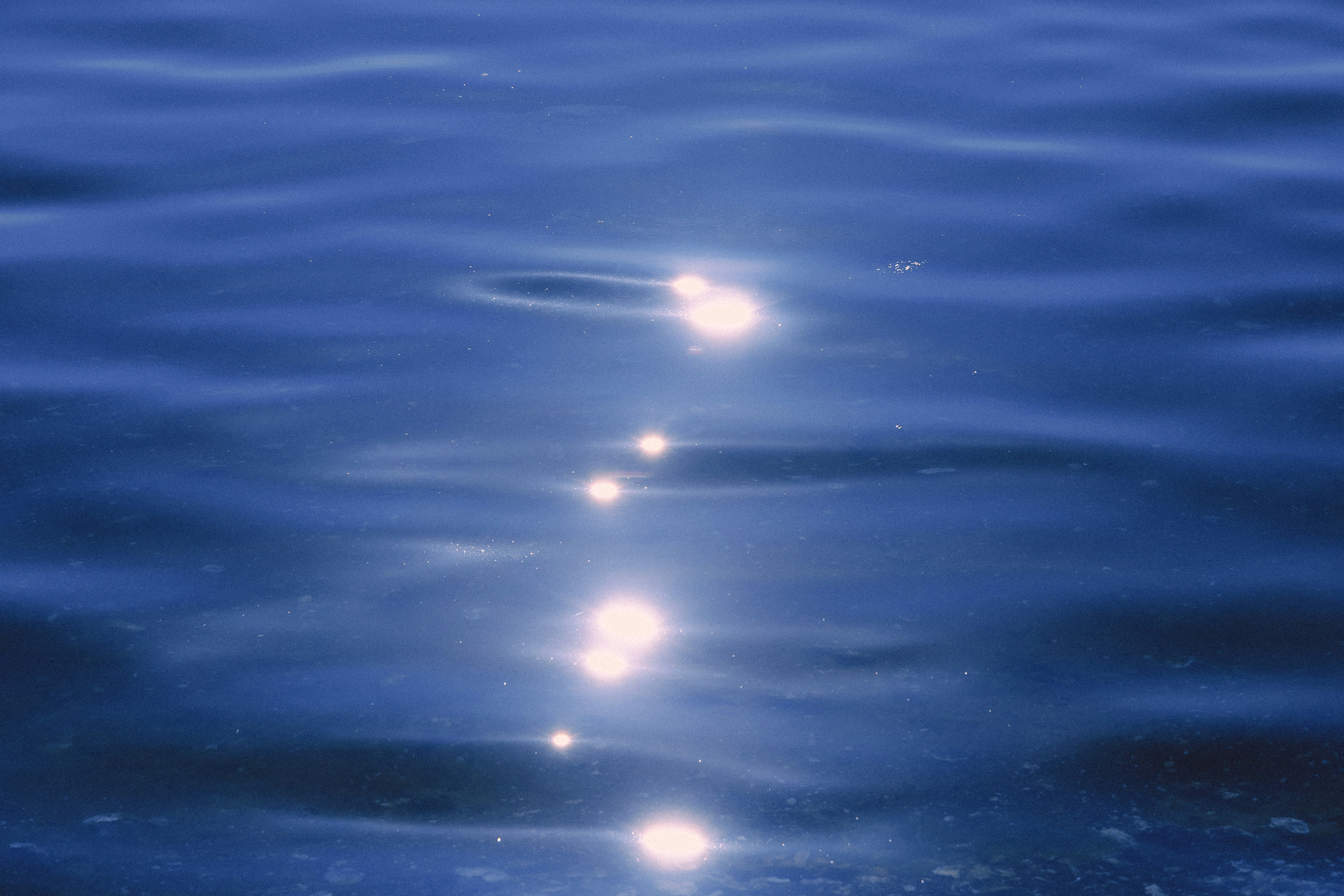 Moonlit Ripples: A Quiet Path of Light on Seawater