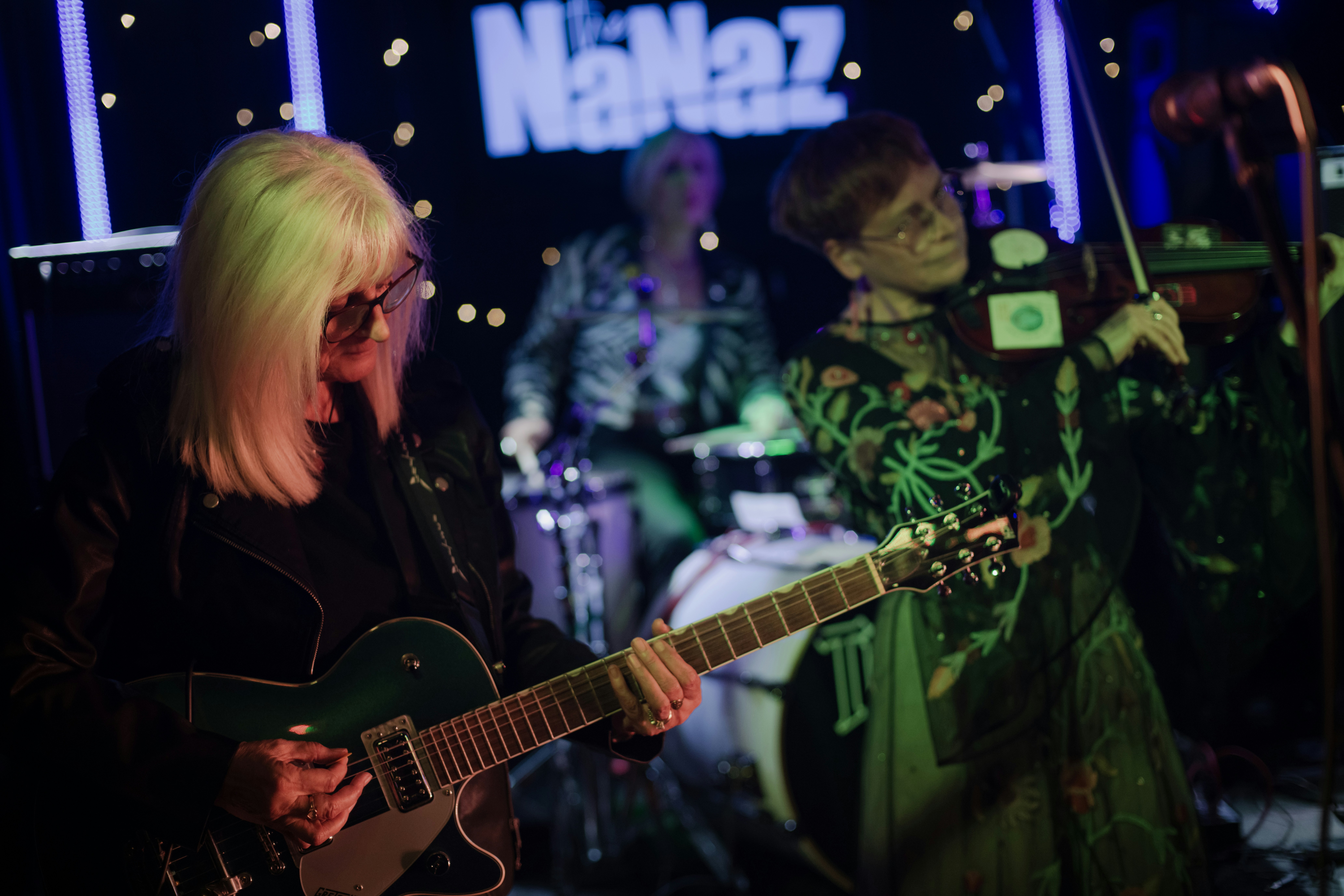 Neon Noir: Dueling Guitars in a Sparkling Live Lounge