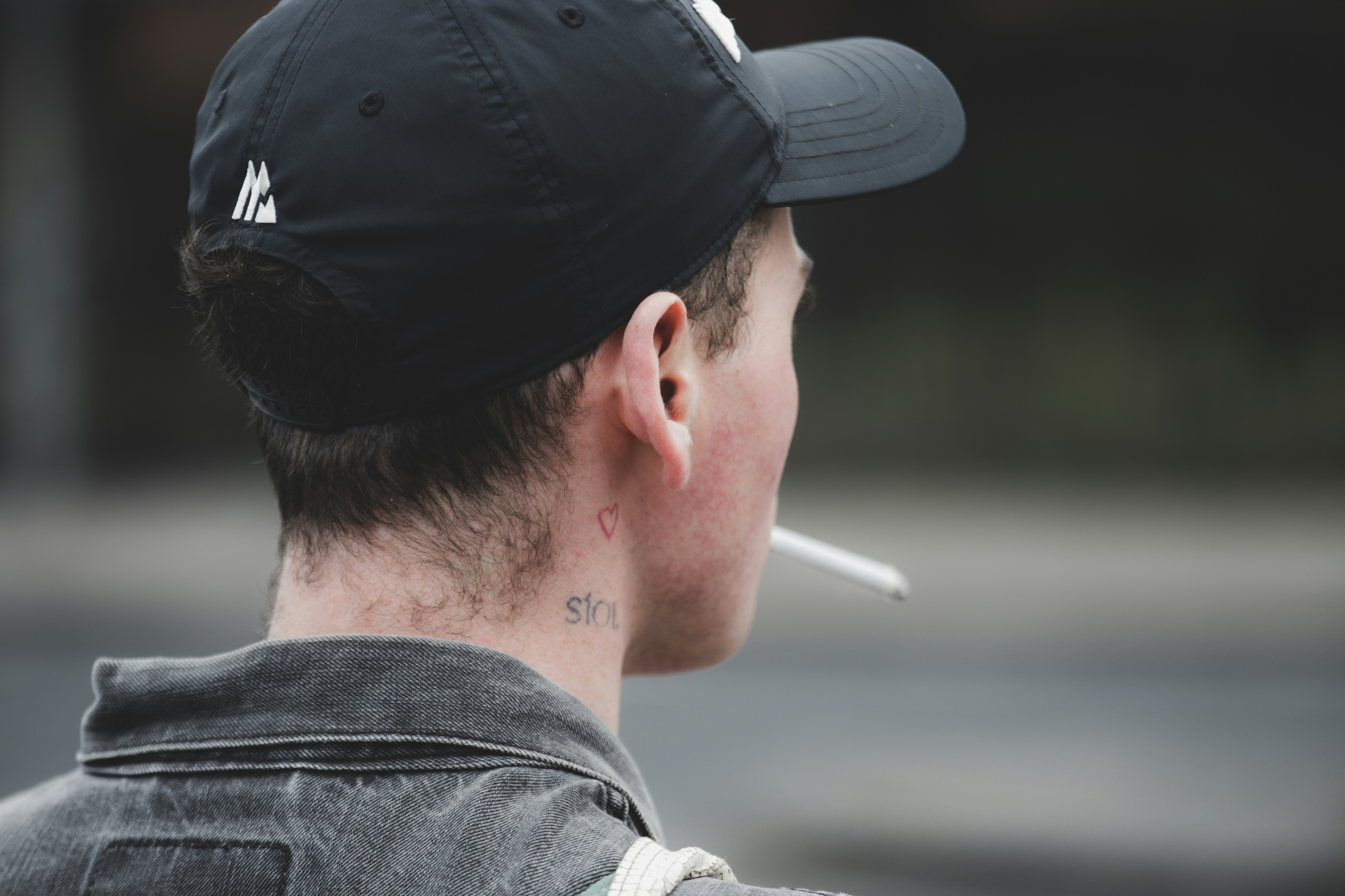 Back-tilted Portrait with Cigarette Shadow and Cap Detail