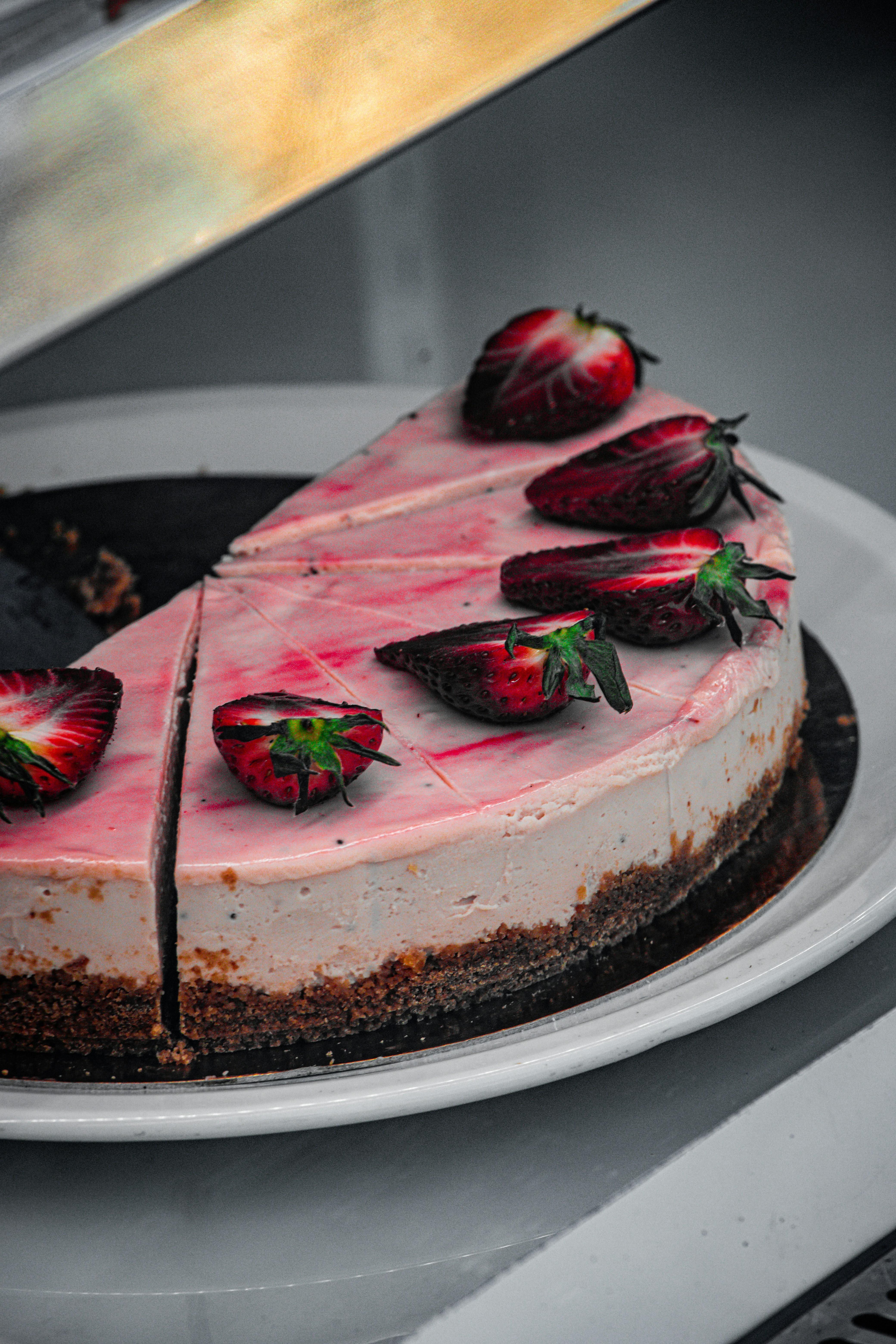 Strawberry-rose Cheesecake Slice Lingers on a Frosted Edge