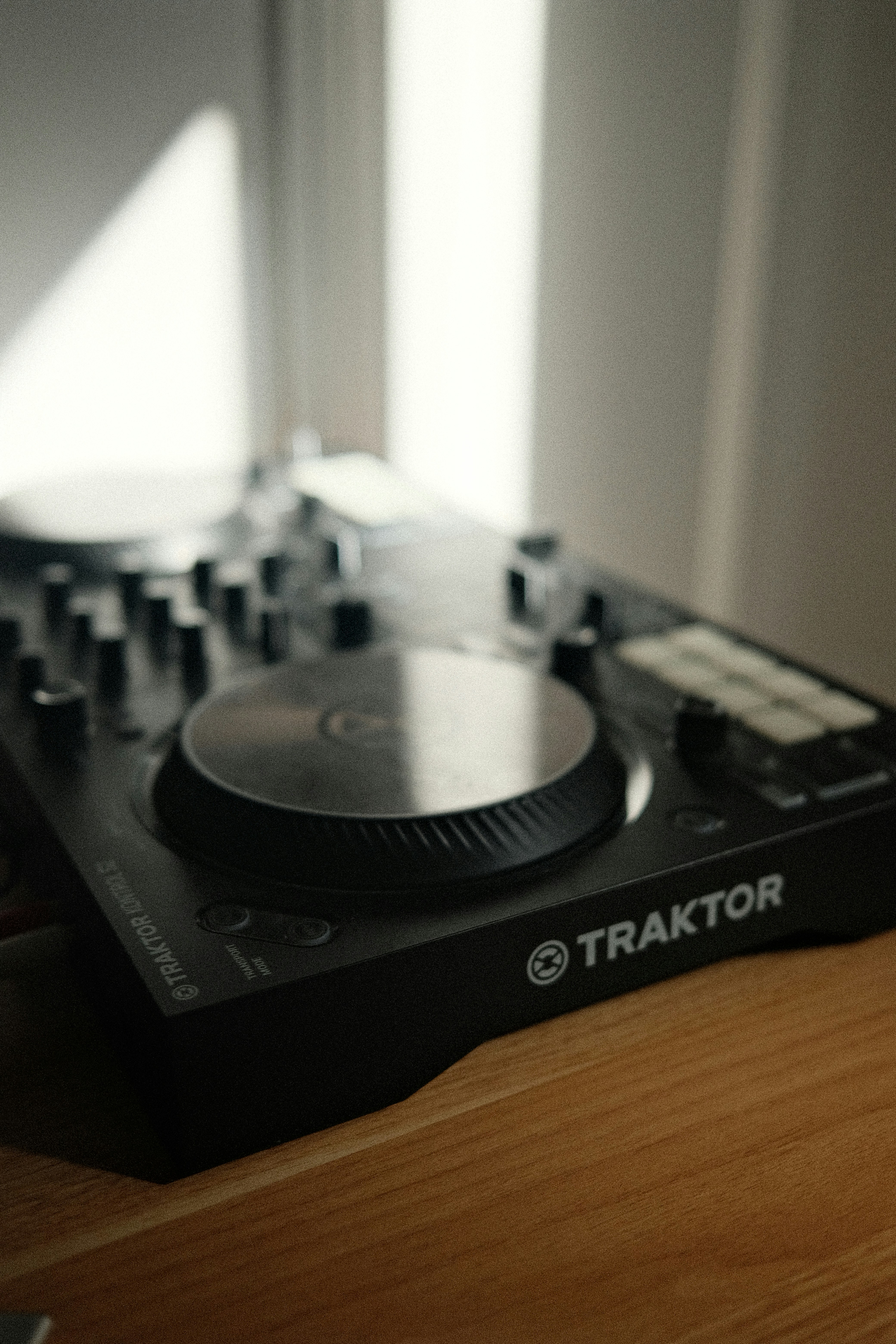Traktor in Focus: A DJ Deck Resting on a Quiet Desk