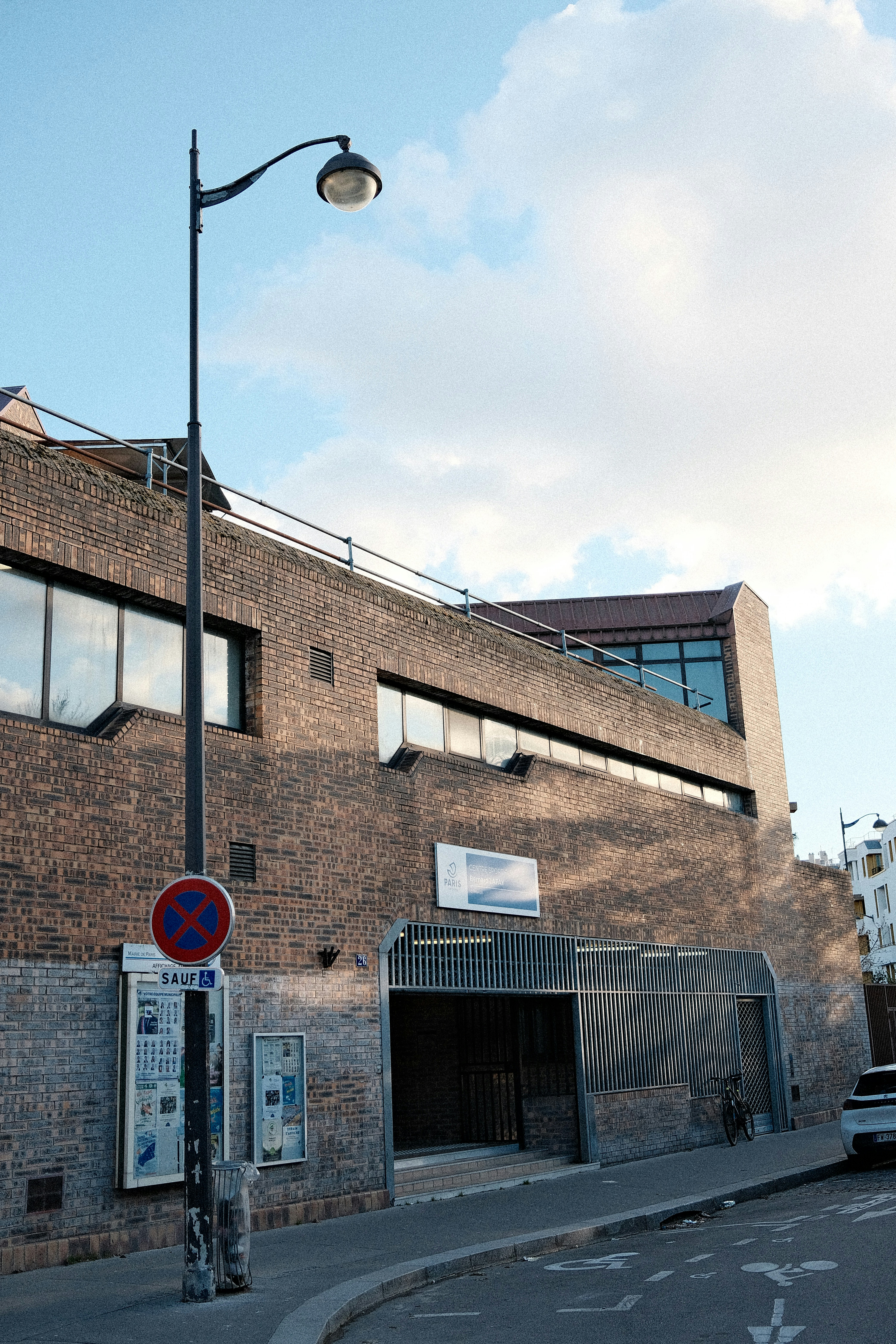Brick Facade and Street Scene Under a Bright Sky