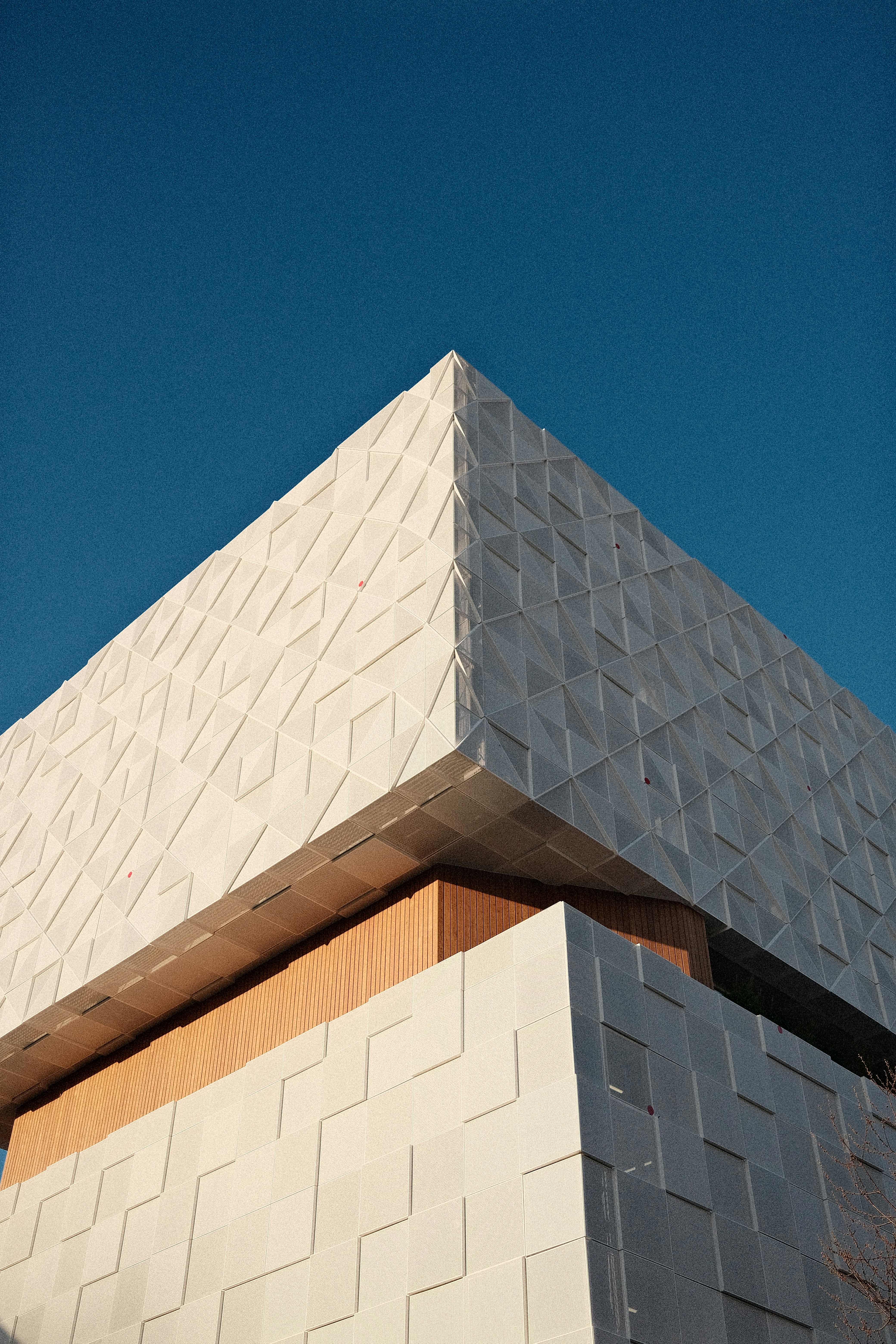 Angular Facade: A Diamond-Cut Monument Reaches for the Sky