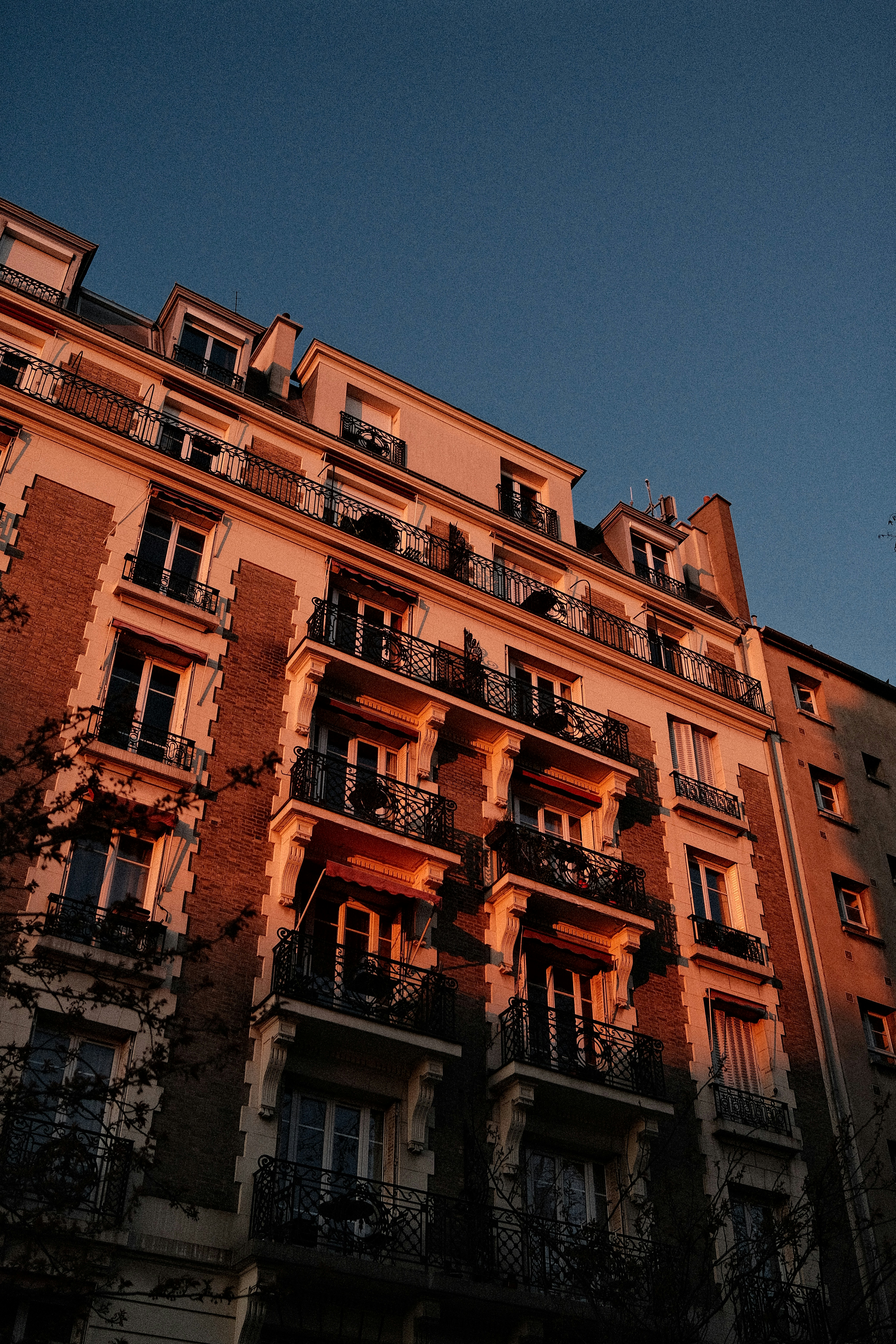 Sunlit Facade: Evening Glow on Parisian Flats