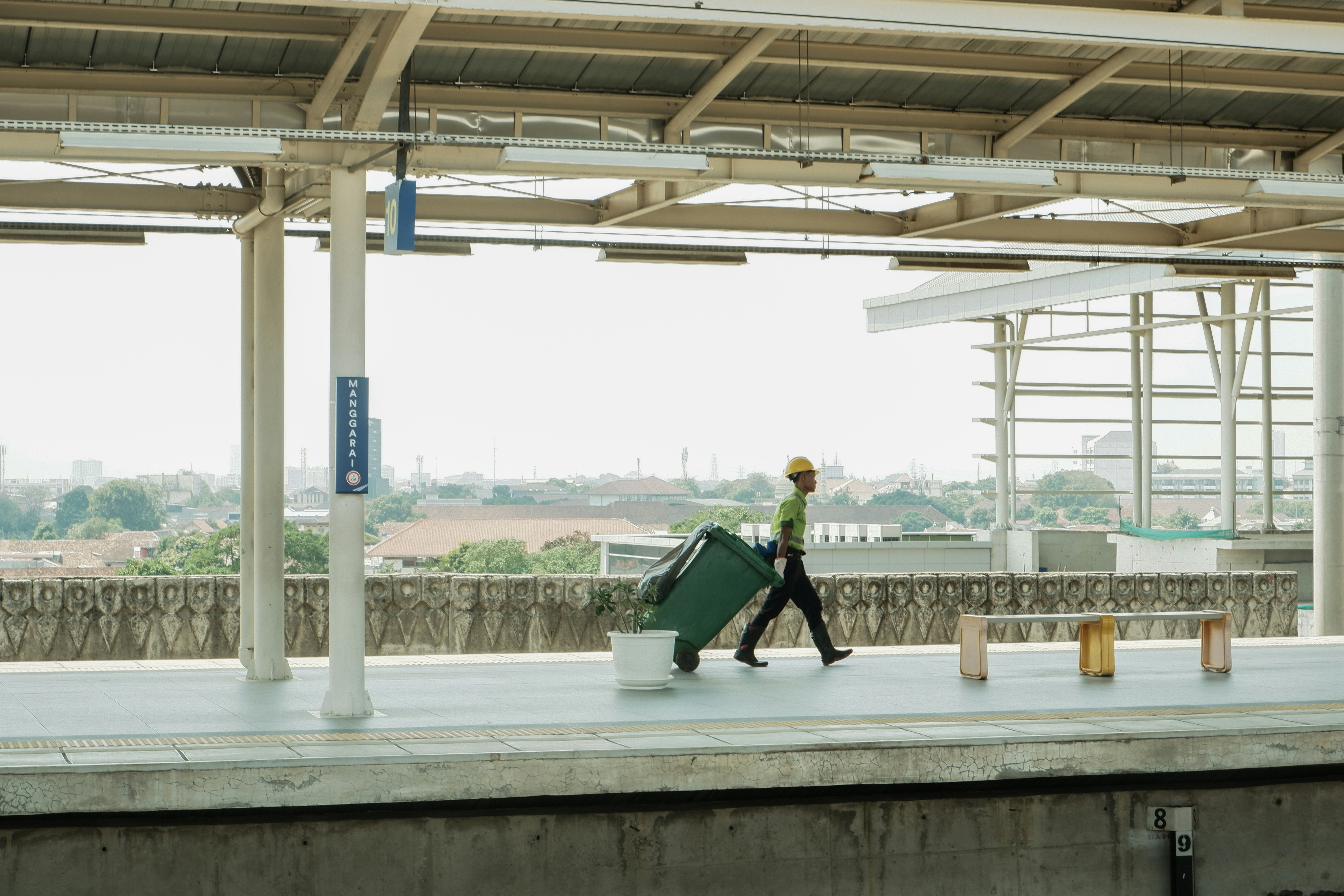 Track Walk: Luggage in Tow Under an Open Railway Platform