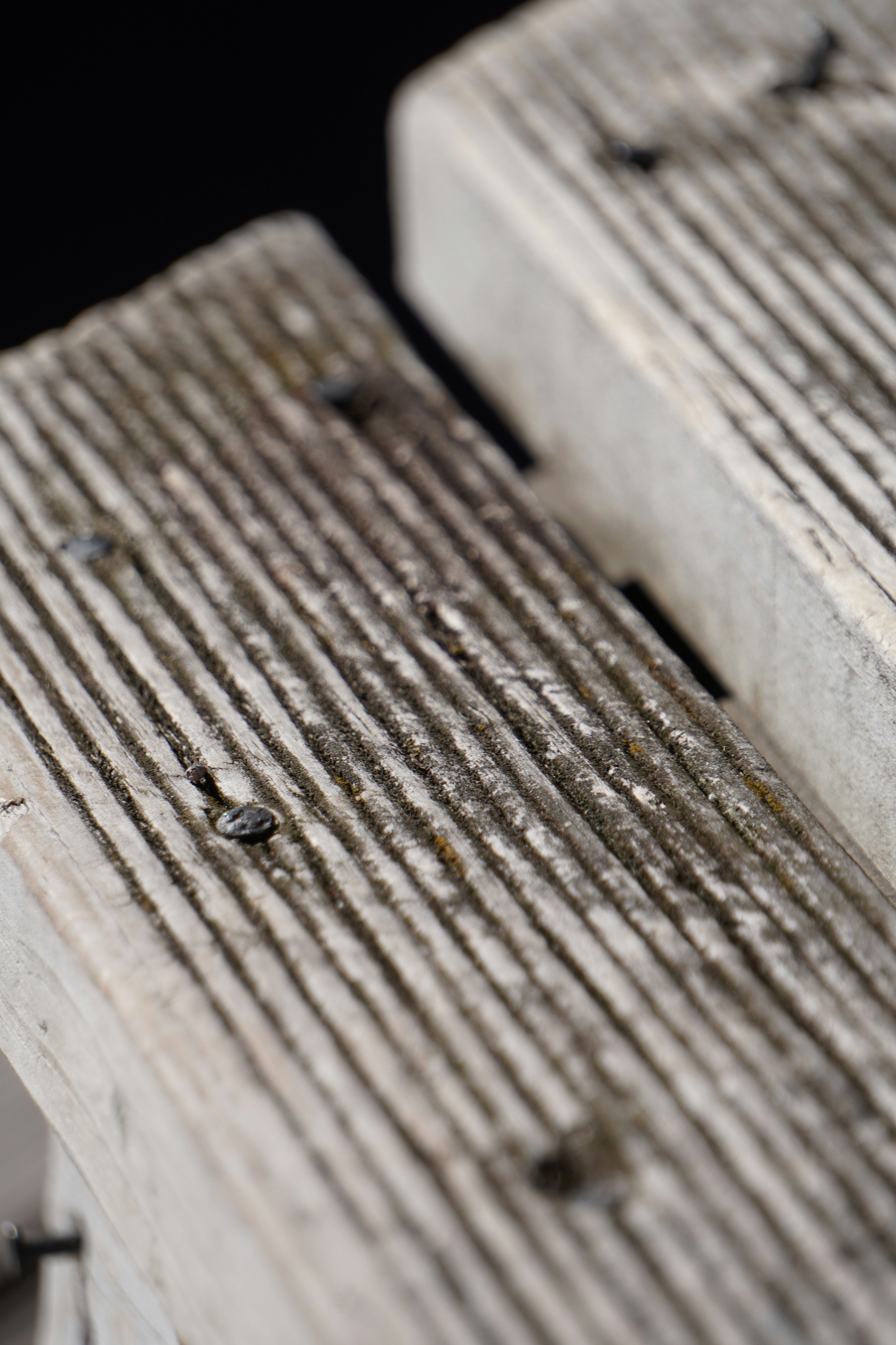 Weathered Slats: A Close-Up Trek Across Rough Timber
