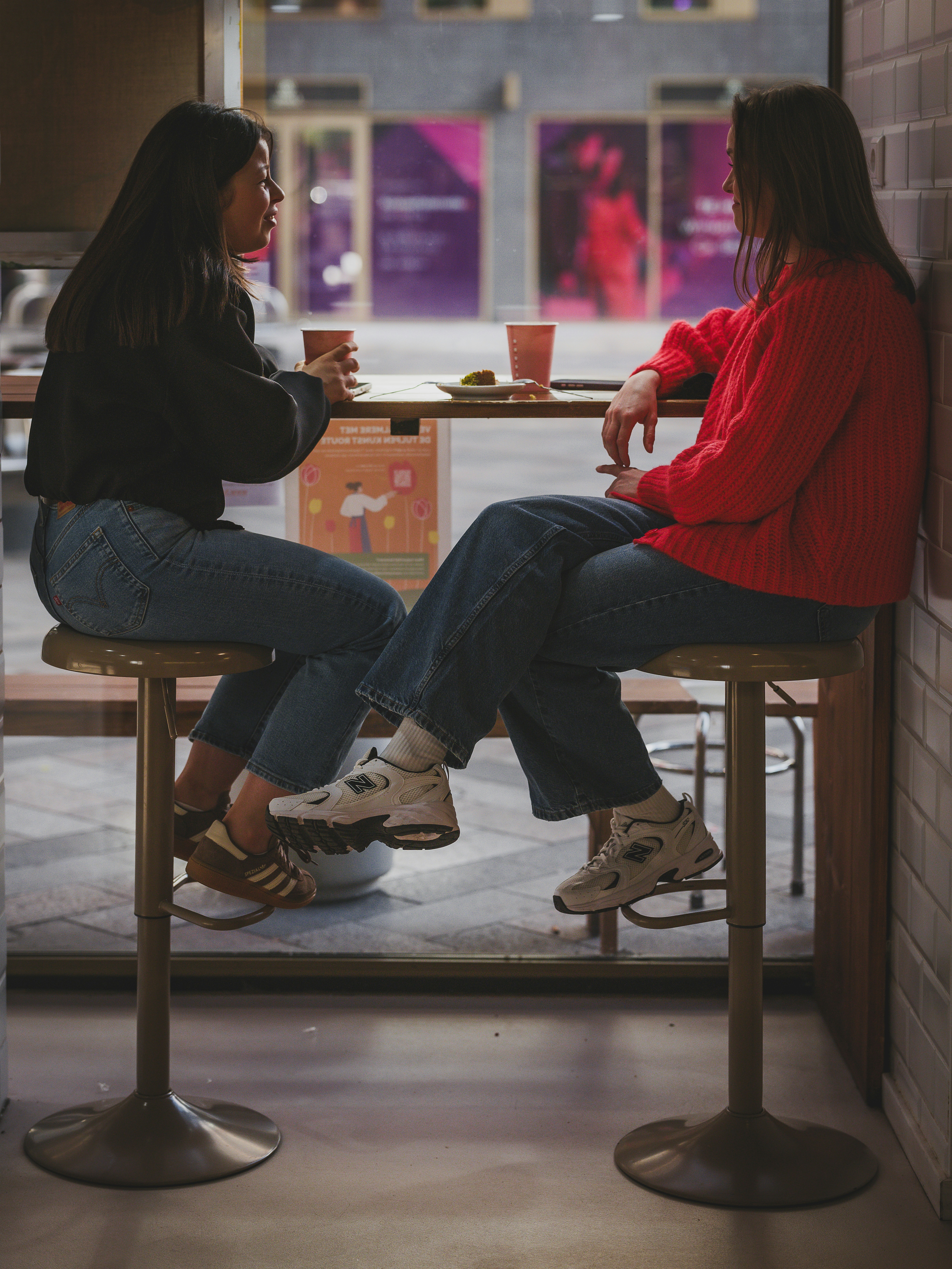Quiet Conversation Over Cups: A Moment in the Café