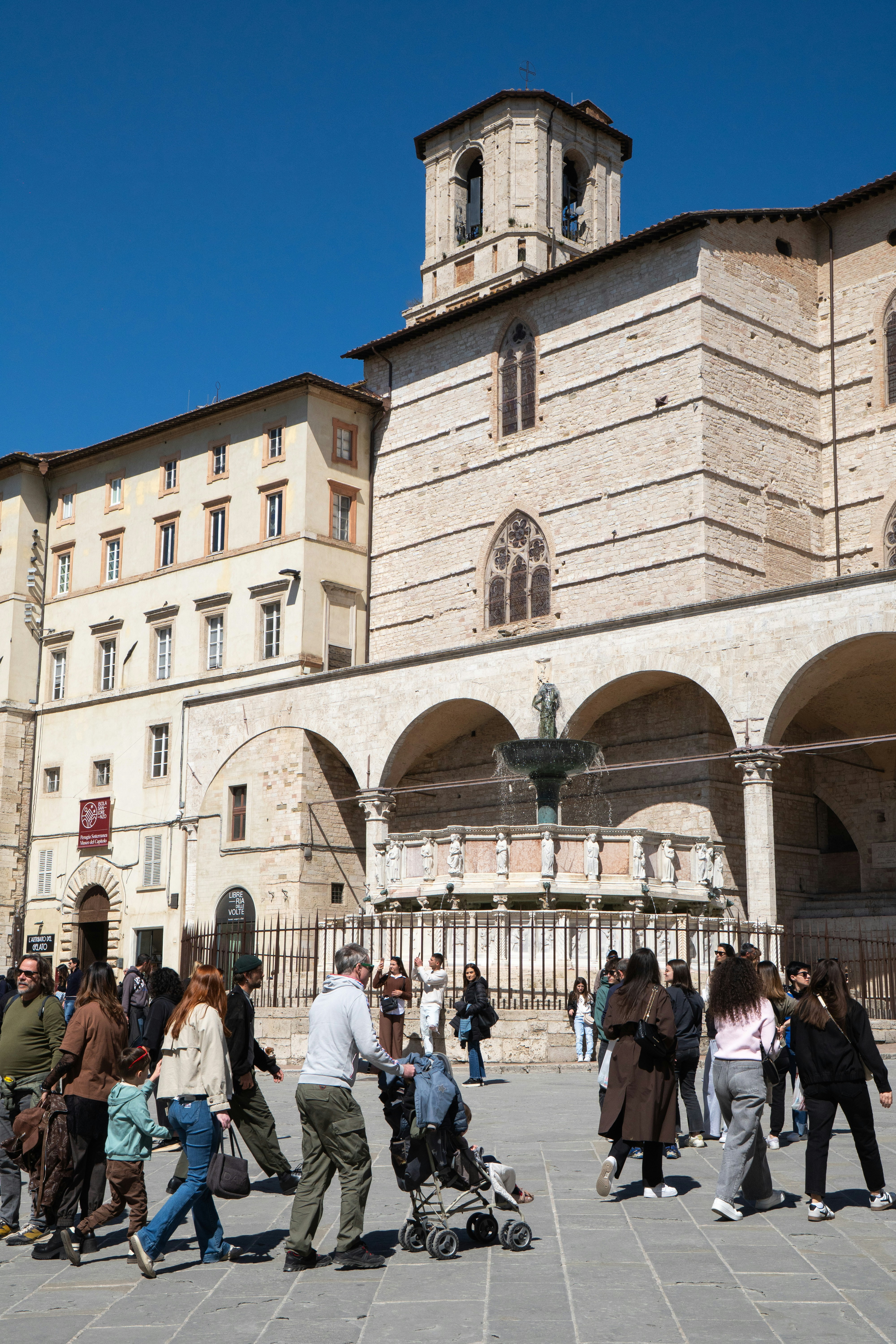 Stone Facade and Fountain: Life in Piazza