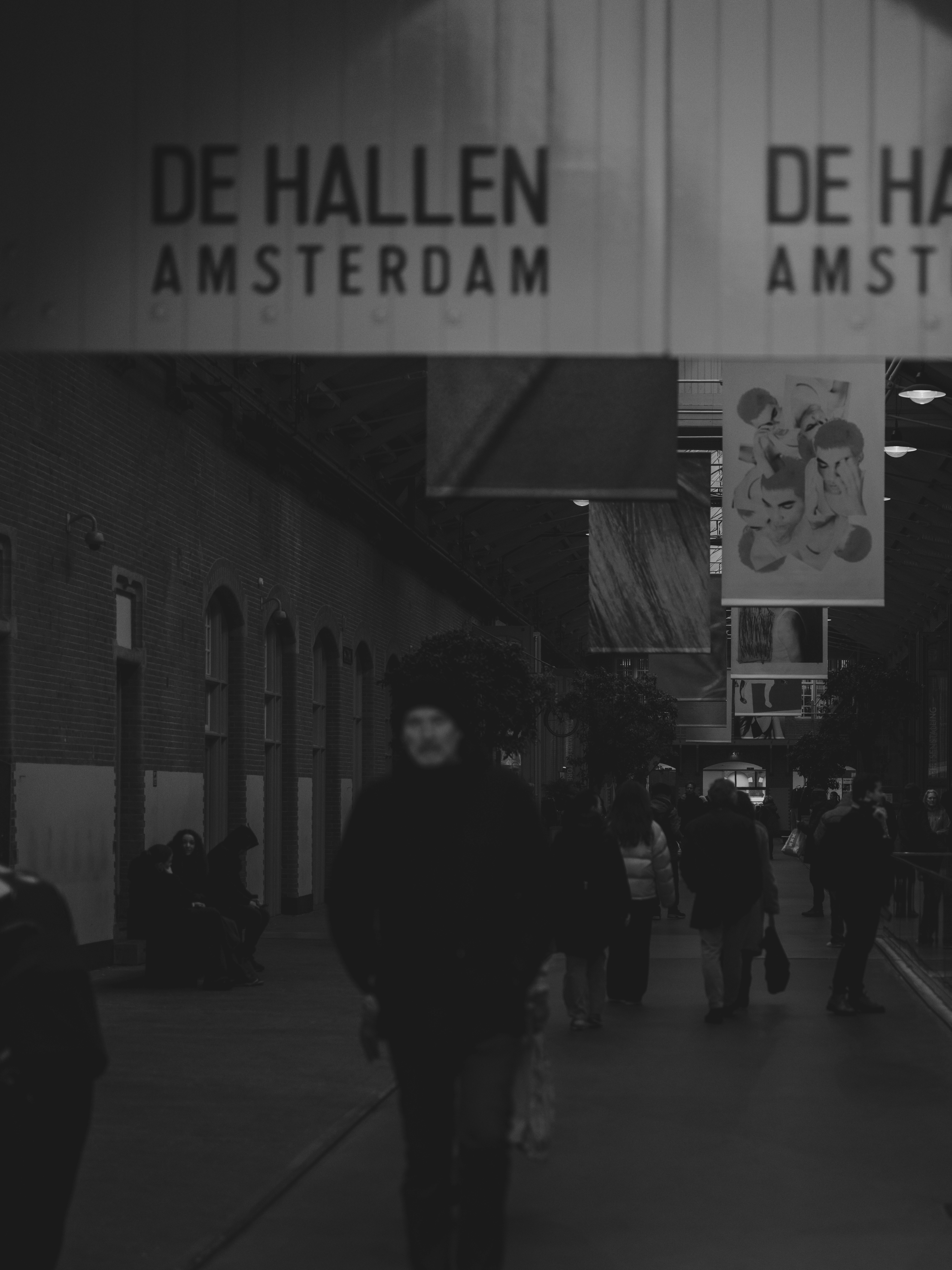 Shadowed Pedestrian in a Dim Urban Corridor