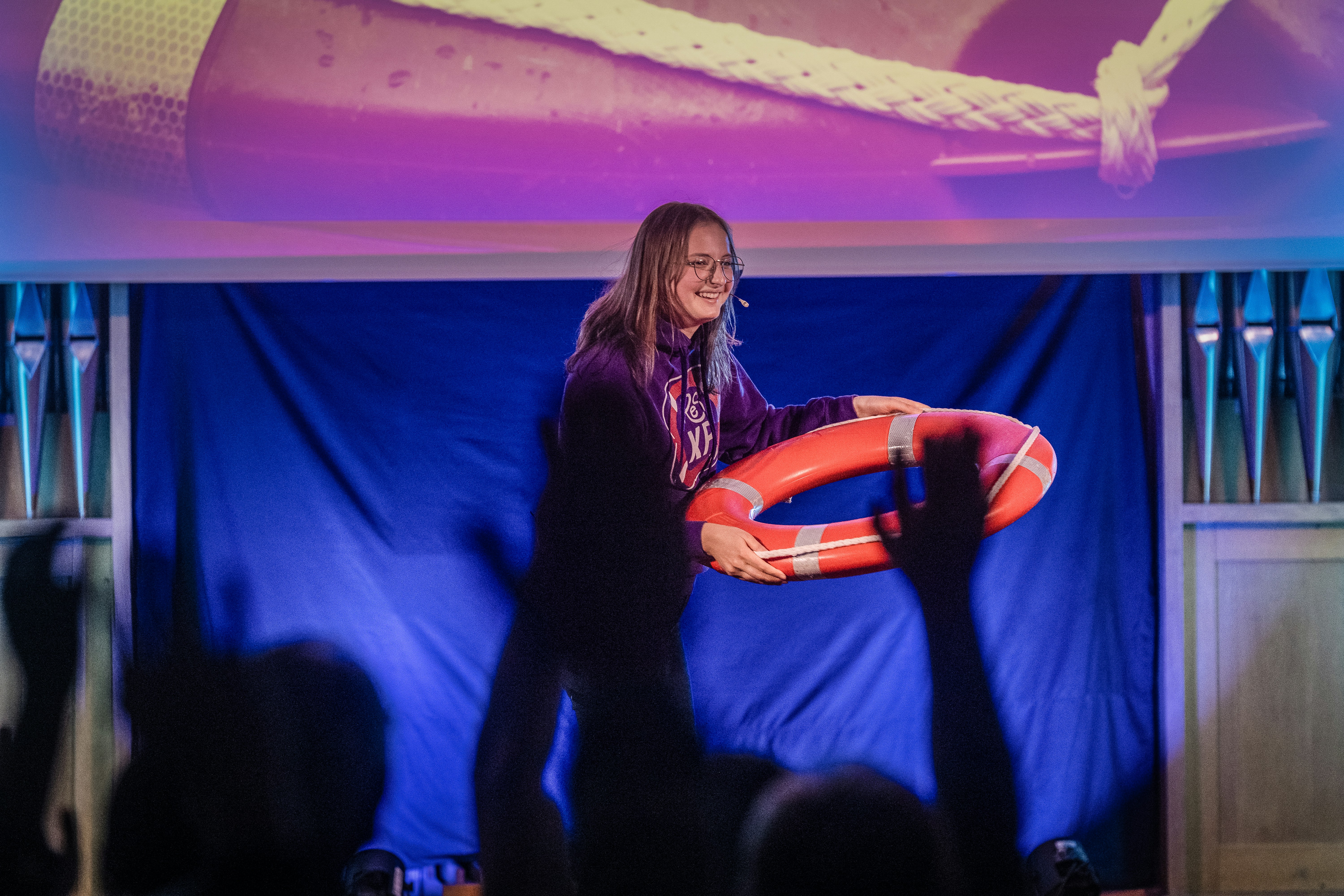 Lifebuoy in Hand: A Jovial Host on Stage