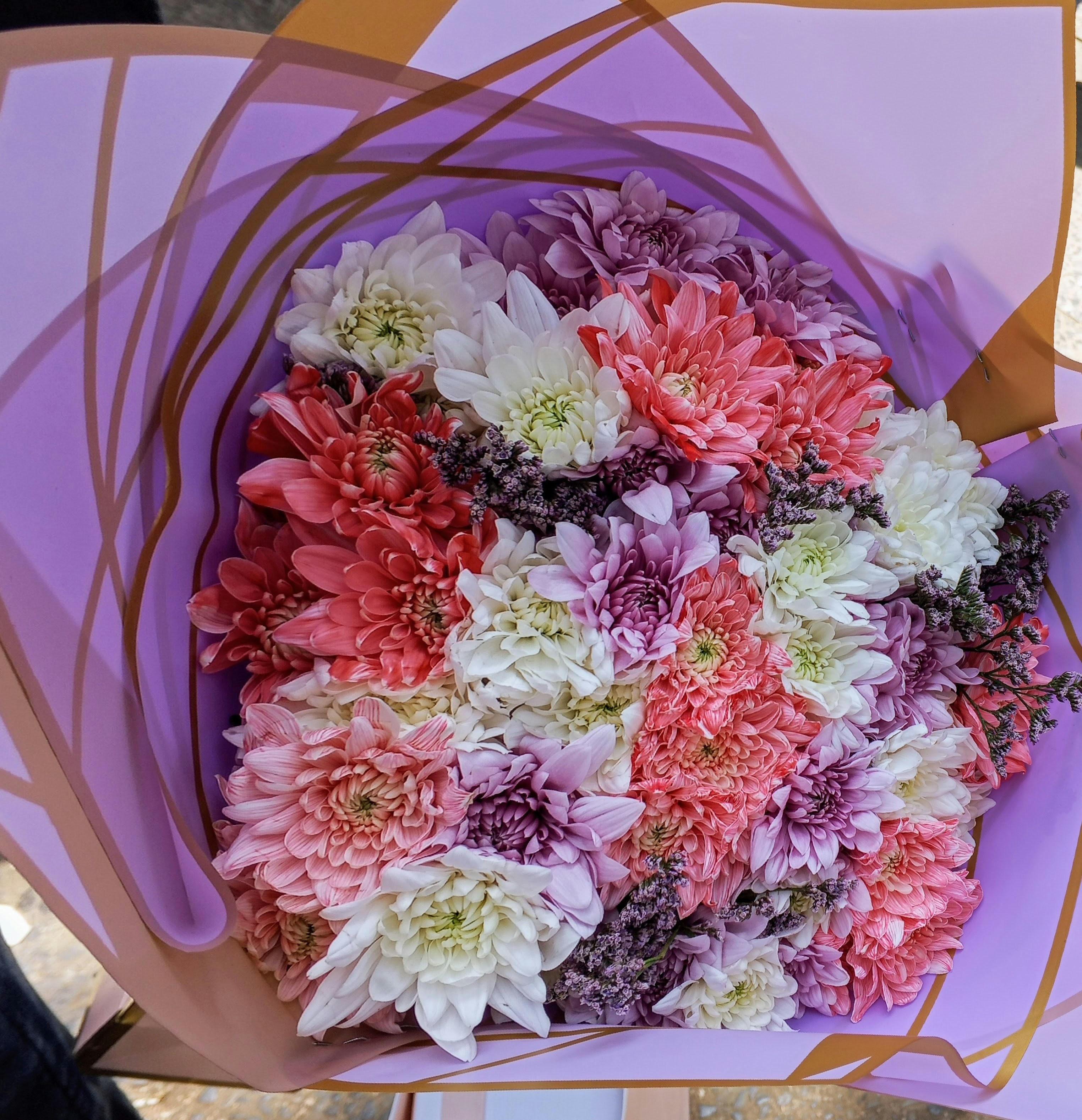 A colorful bouquet of chrysanthemums and other flowers