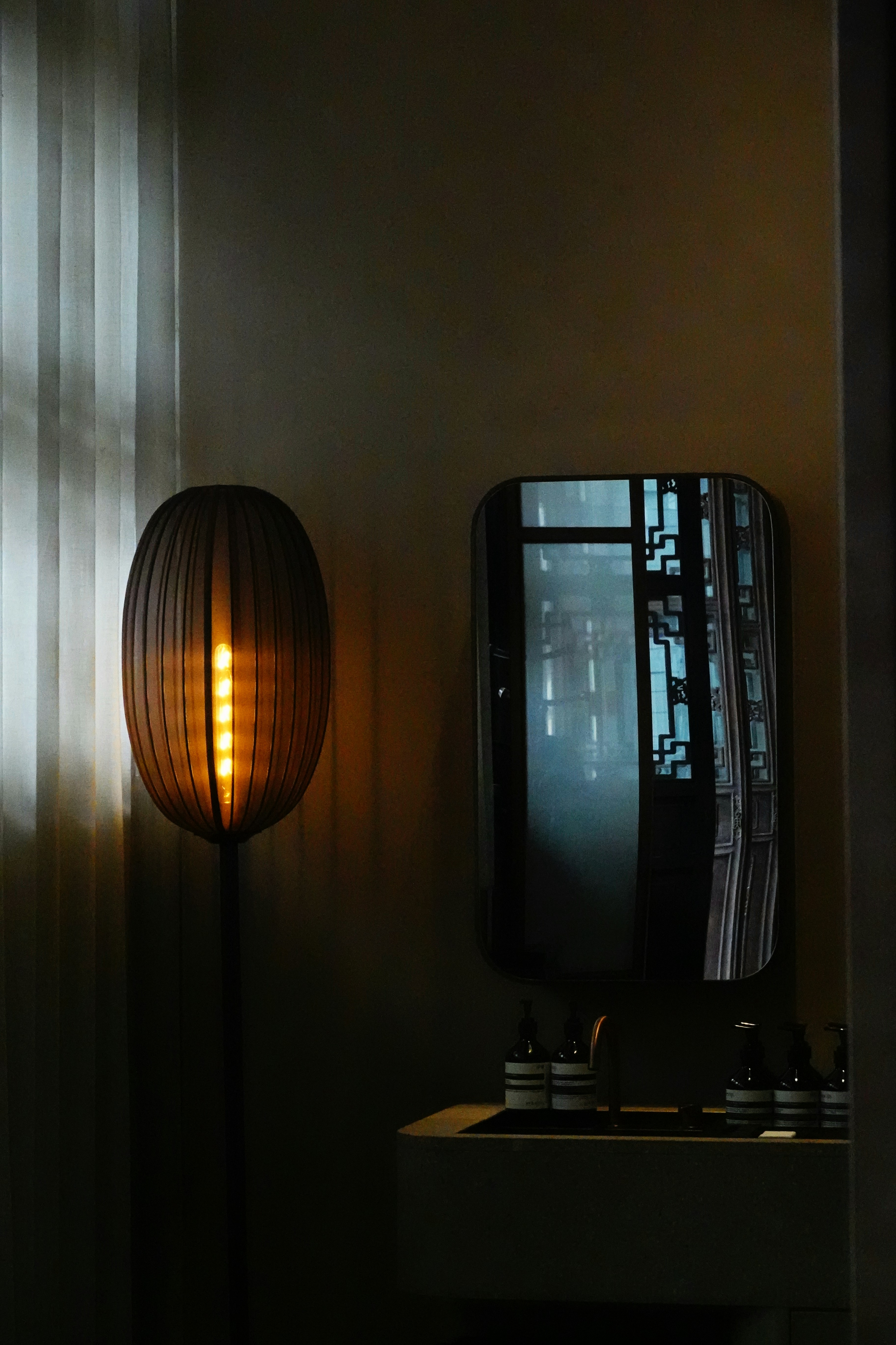 Warm Glow and Quiet Reflection in a Dim Dressing Room