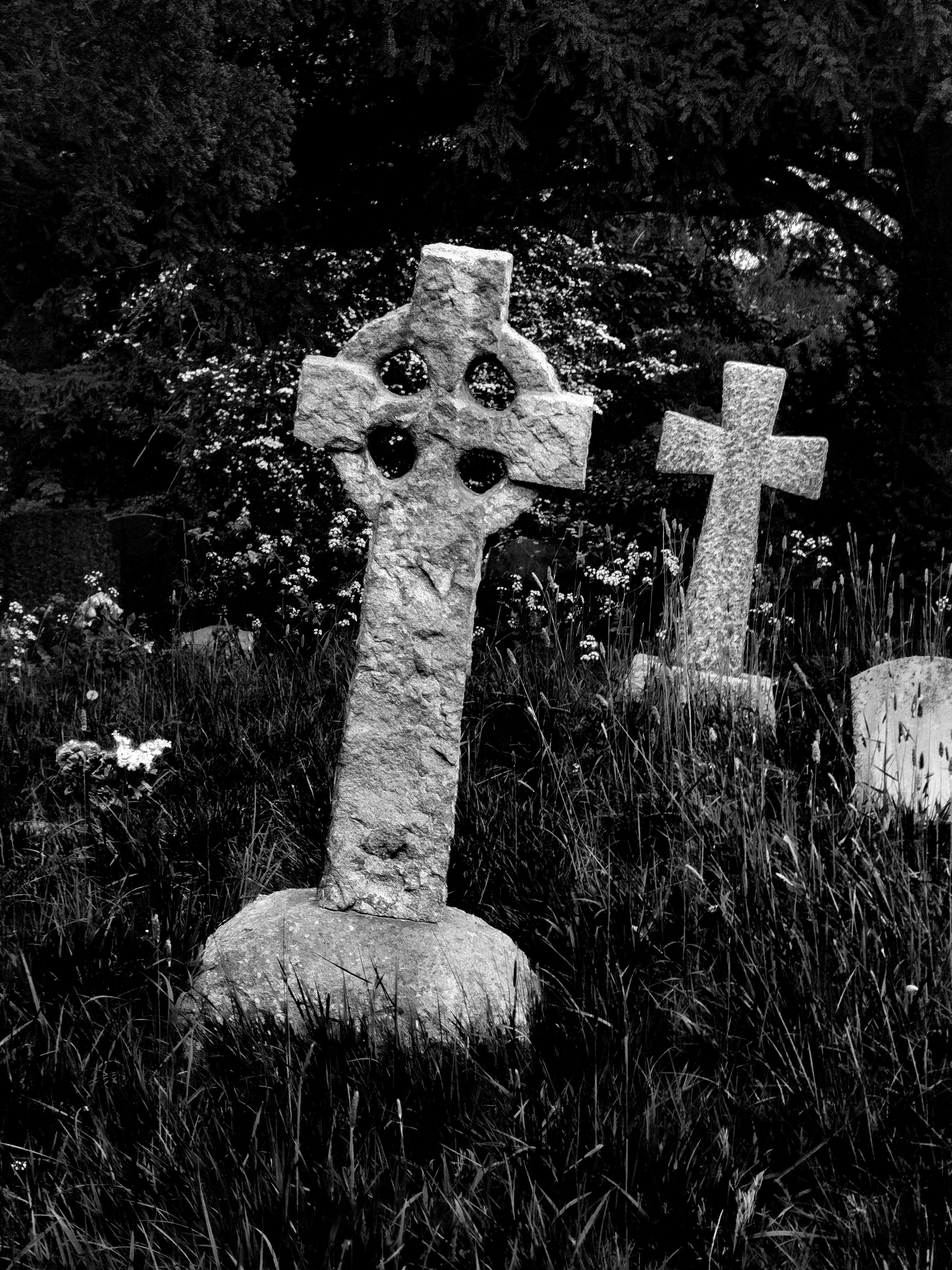 Weathered Celtic Crosses in a Quiet Graveyard