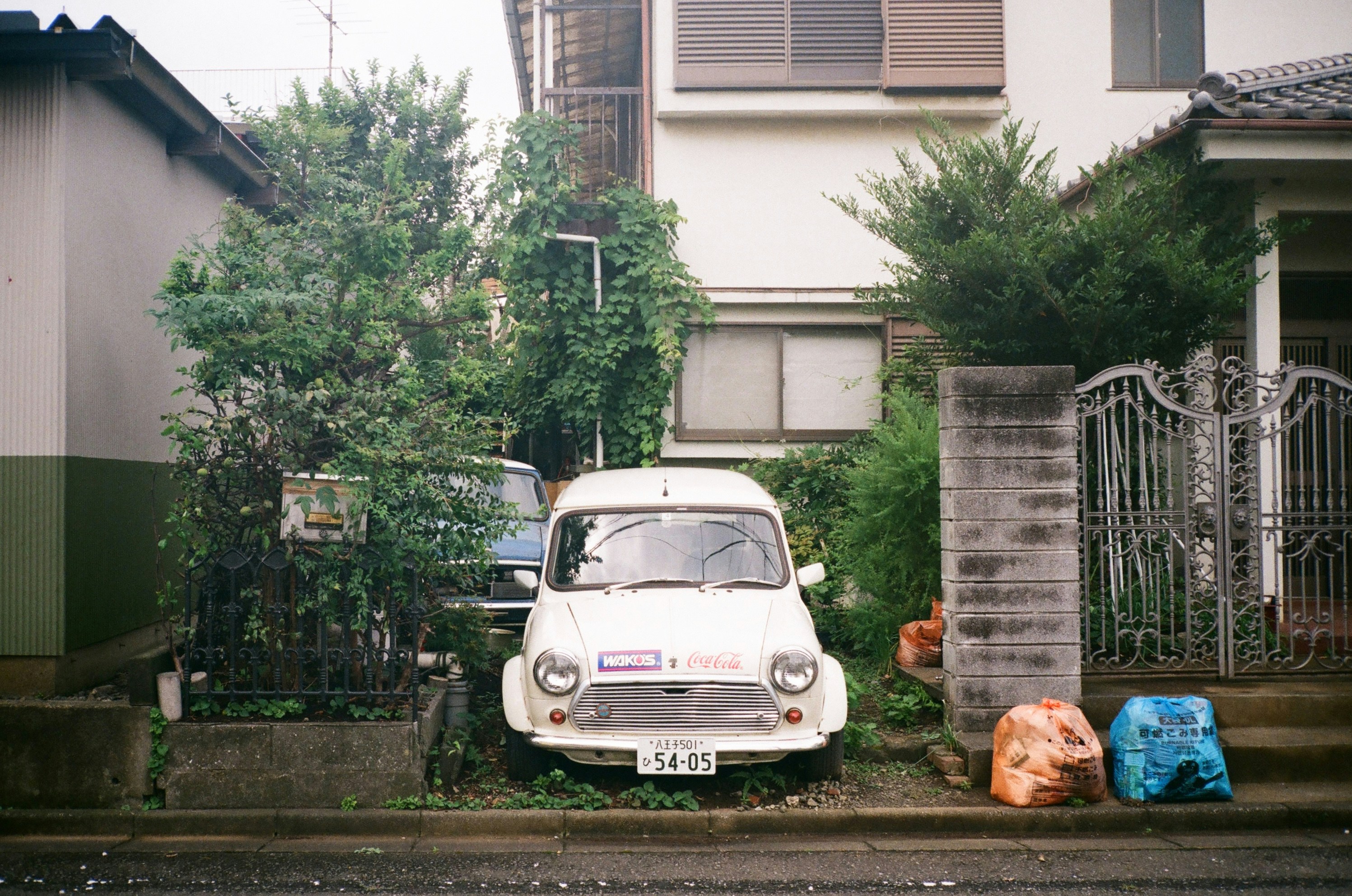 Quiet Japanese Street, Vintage Car, and Greenery Framing the Quiet Morning