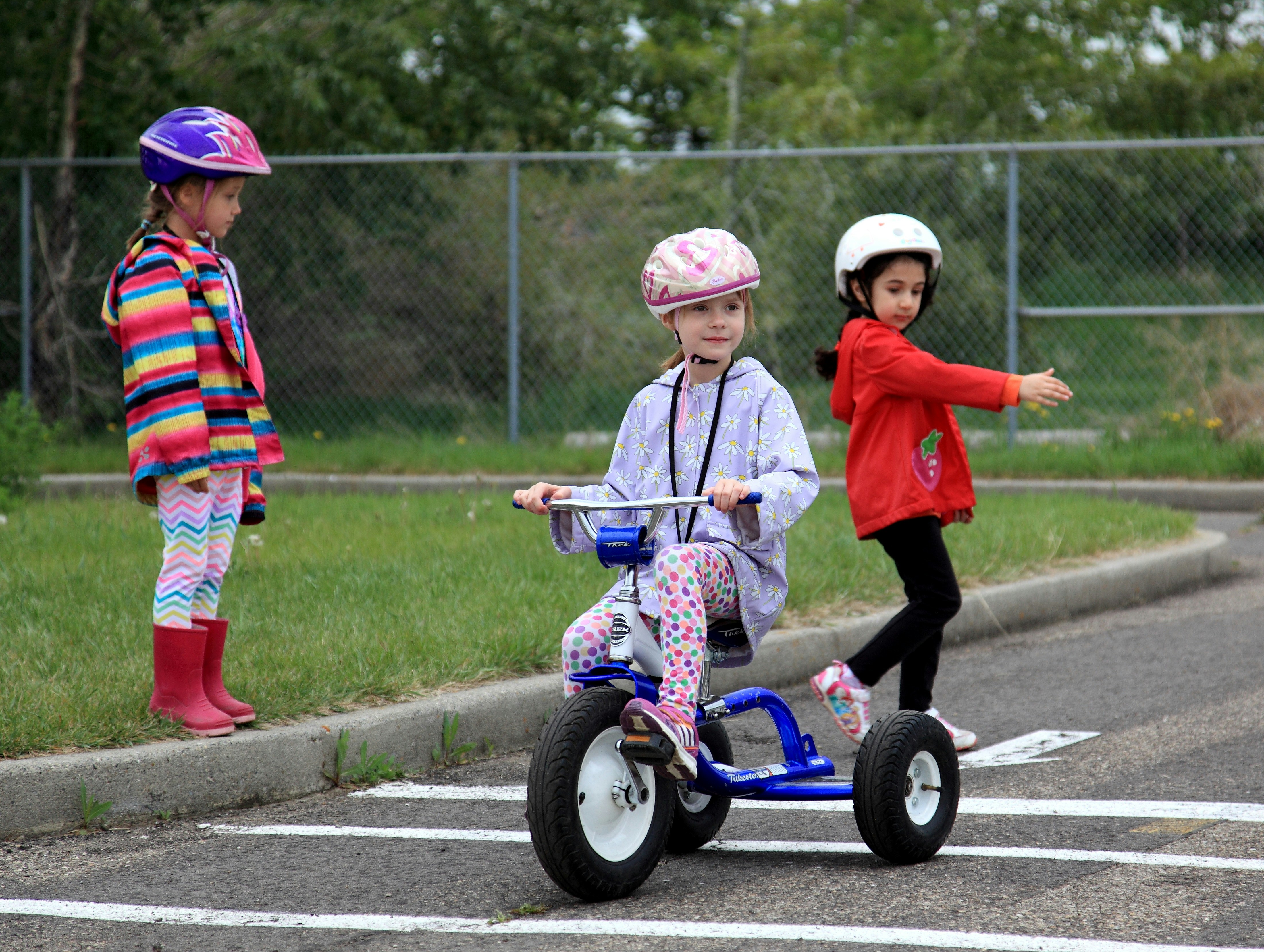 Tiny Cyclist on a Sunny Parking Lot Adventure