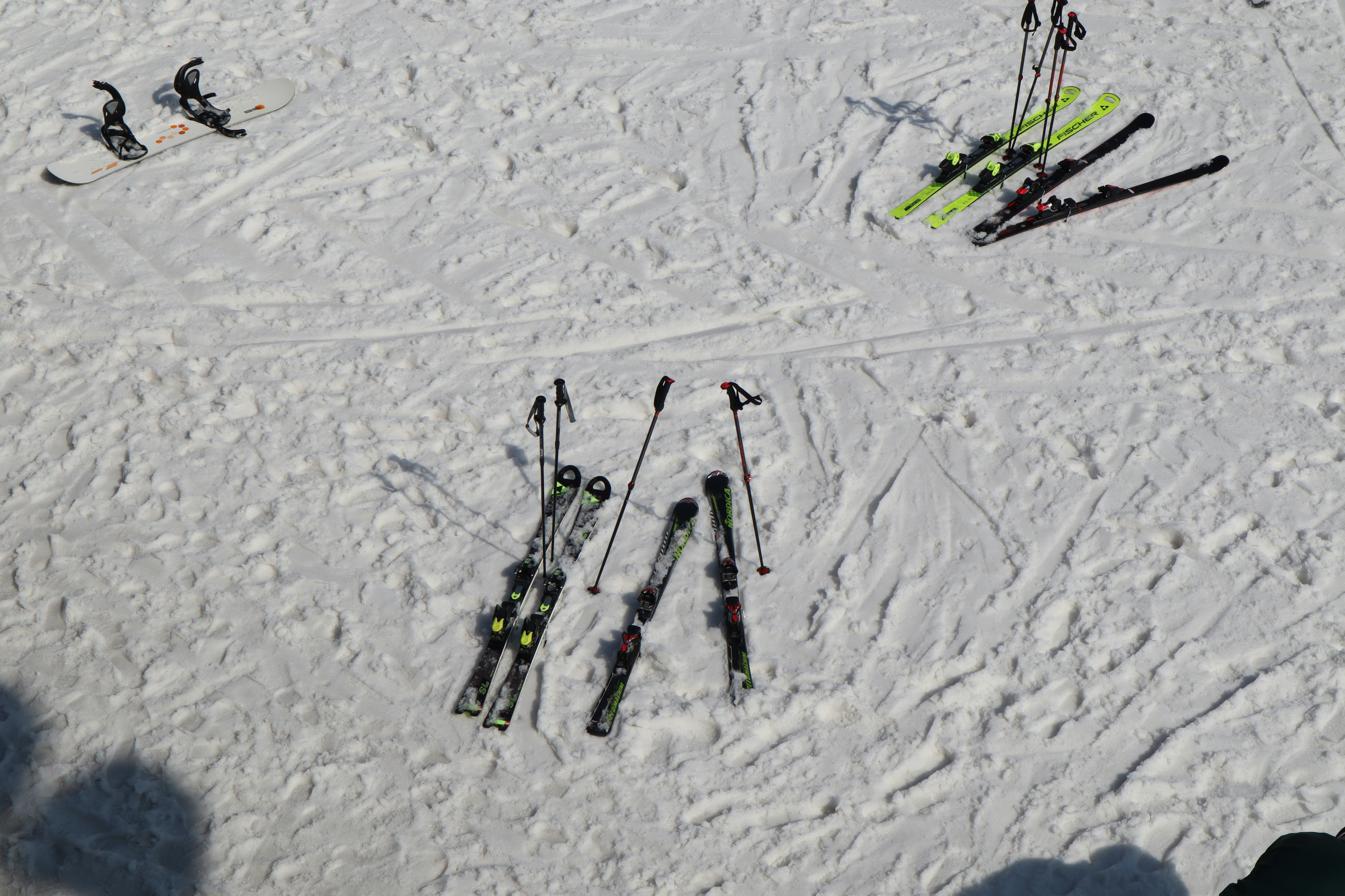 Groomed Slopes: Ski Gear Resting in Fresh Snow