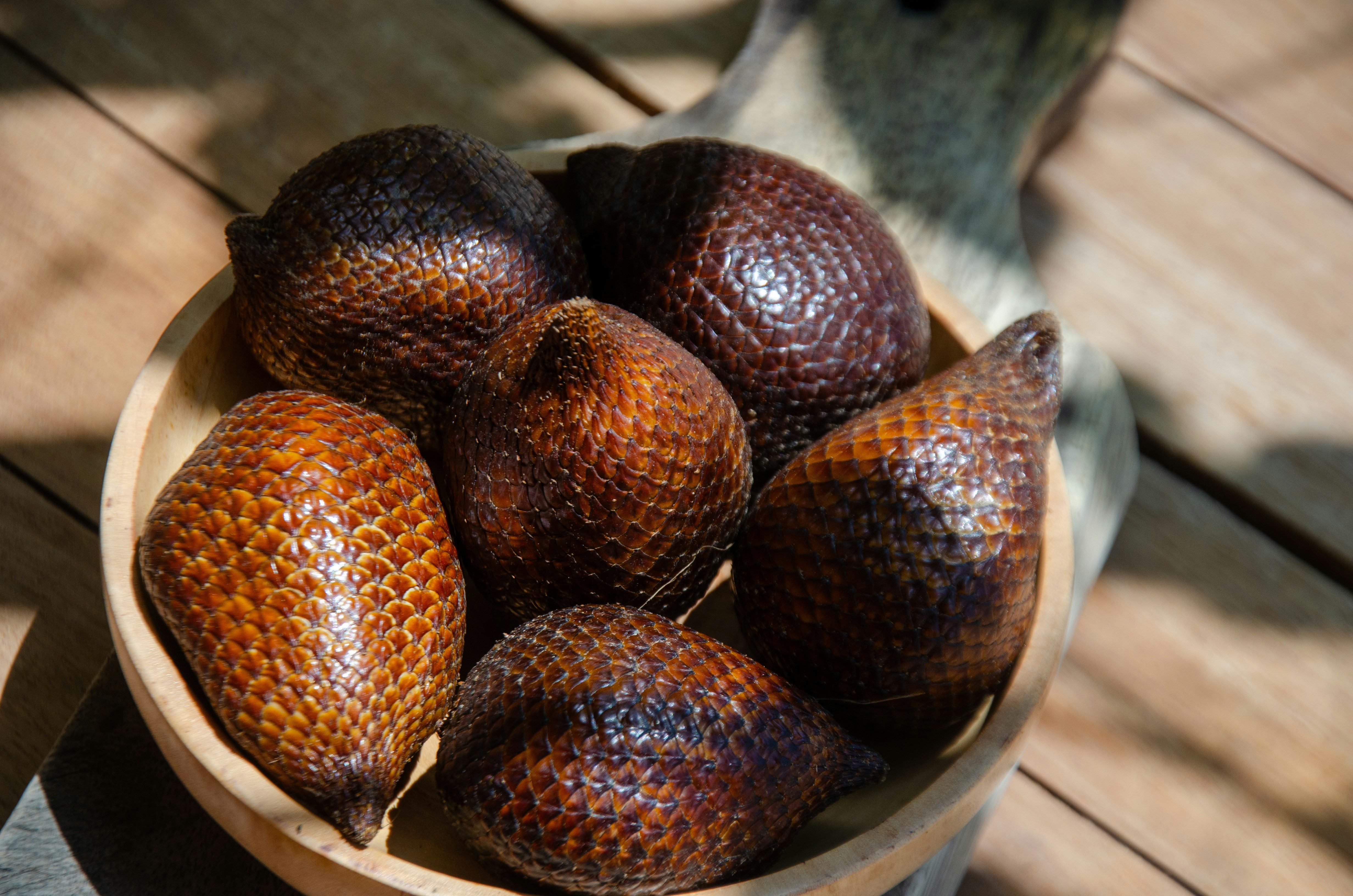 Clay-Burnished Nuts in a Wooden Bowl