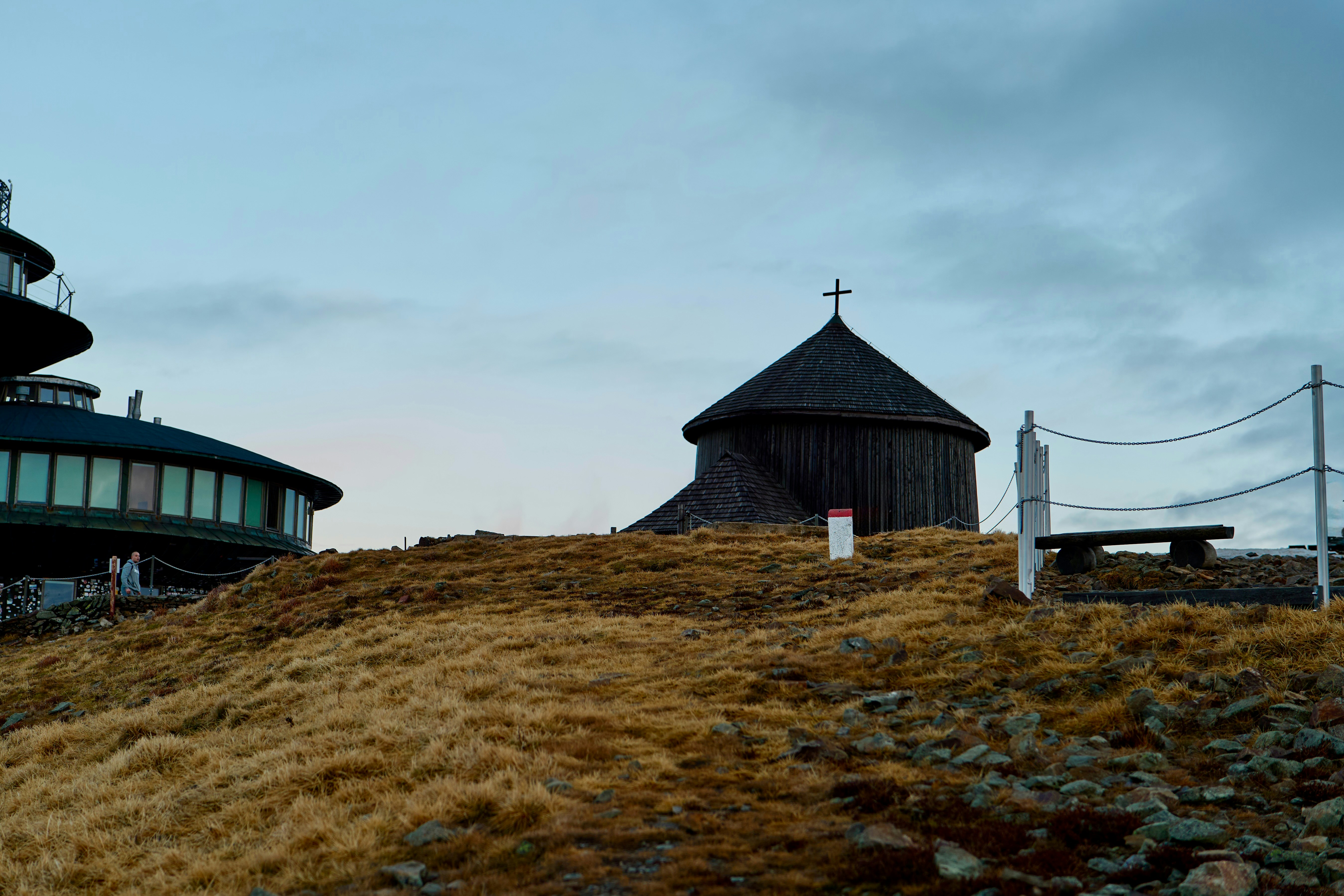 Rooftop Visions: A Chapel and Control Tower on a Windswept Moor