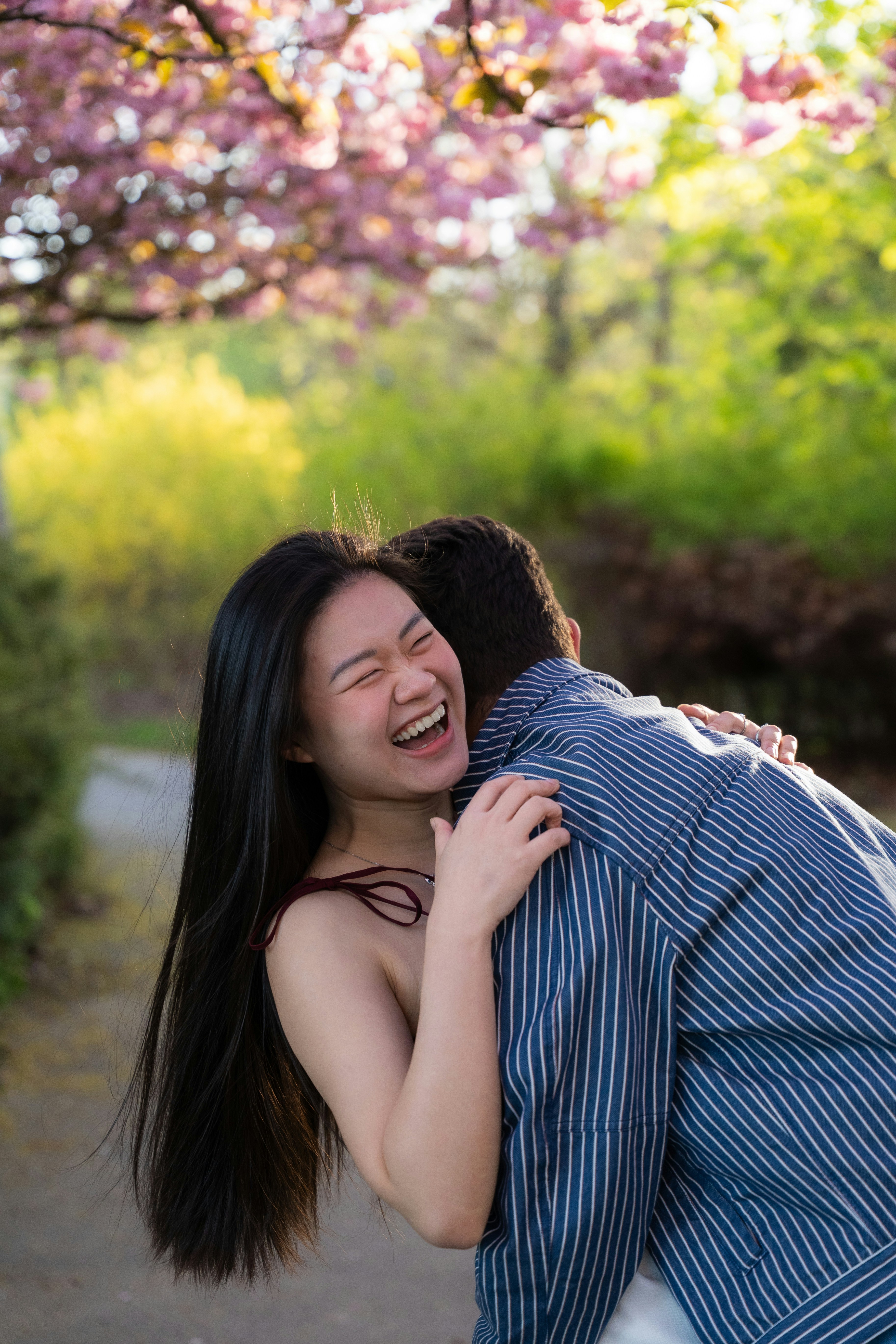 Joy in the Orchard: A Laugh Shared in Spring Light