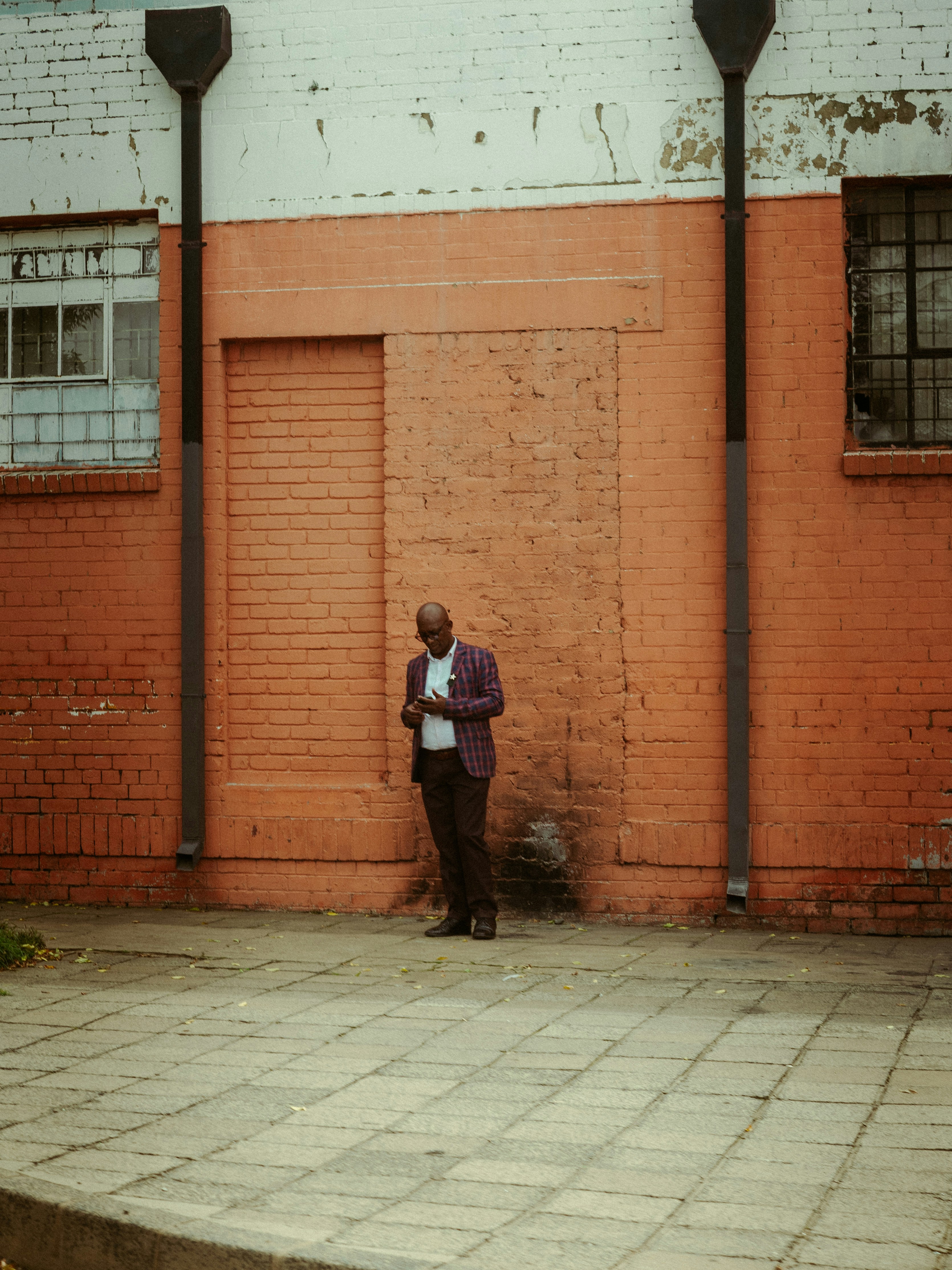 Portrait in the Cracked Brick: Urban Quiet by the Wall