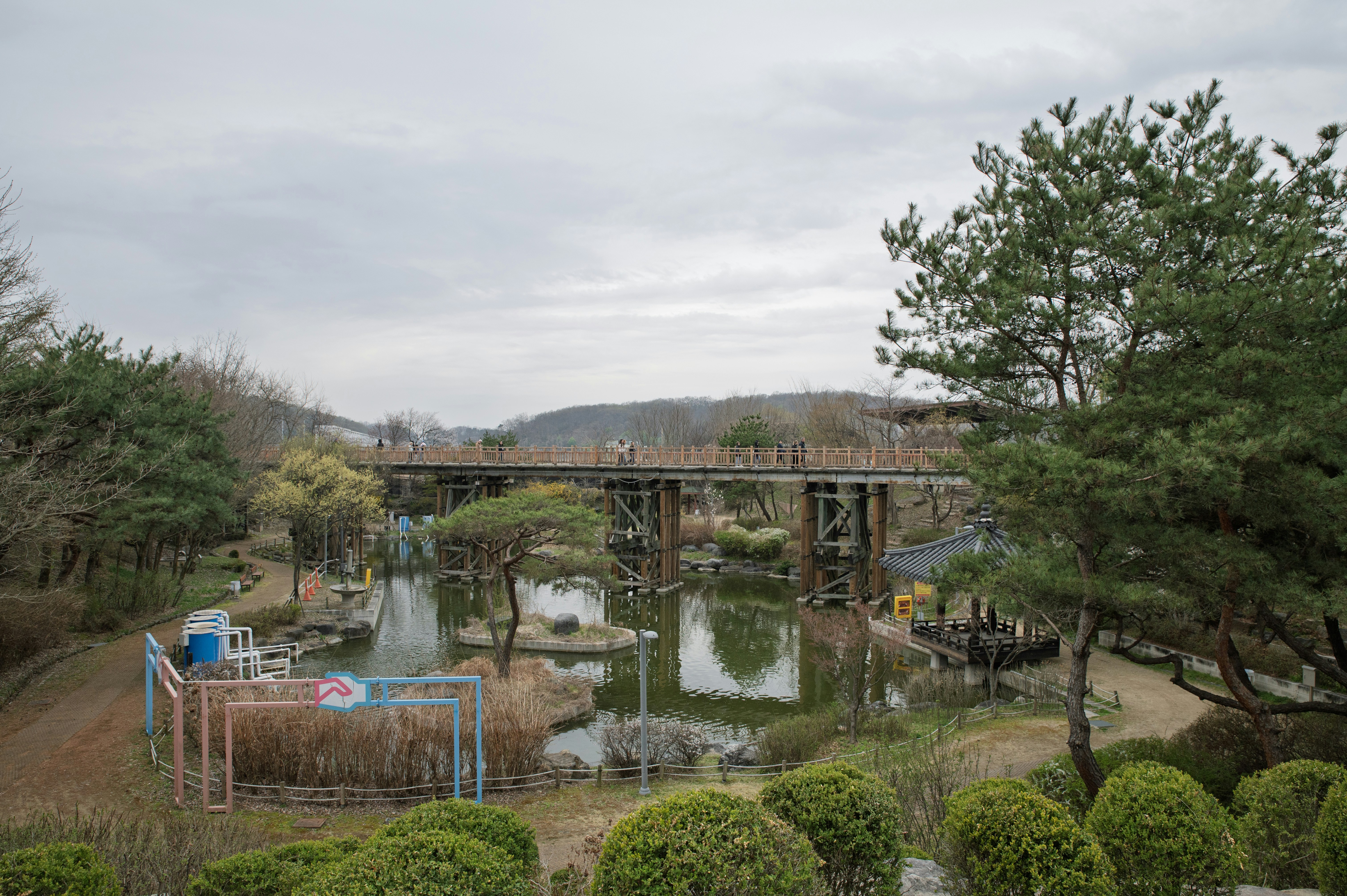 Bridge Over Calm Water: A Quiet Riverside in the Park