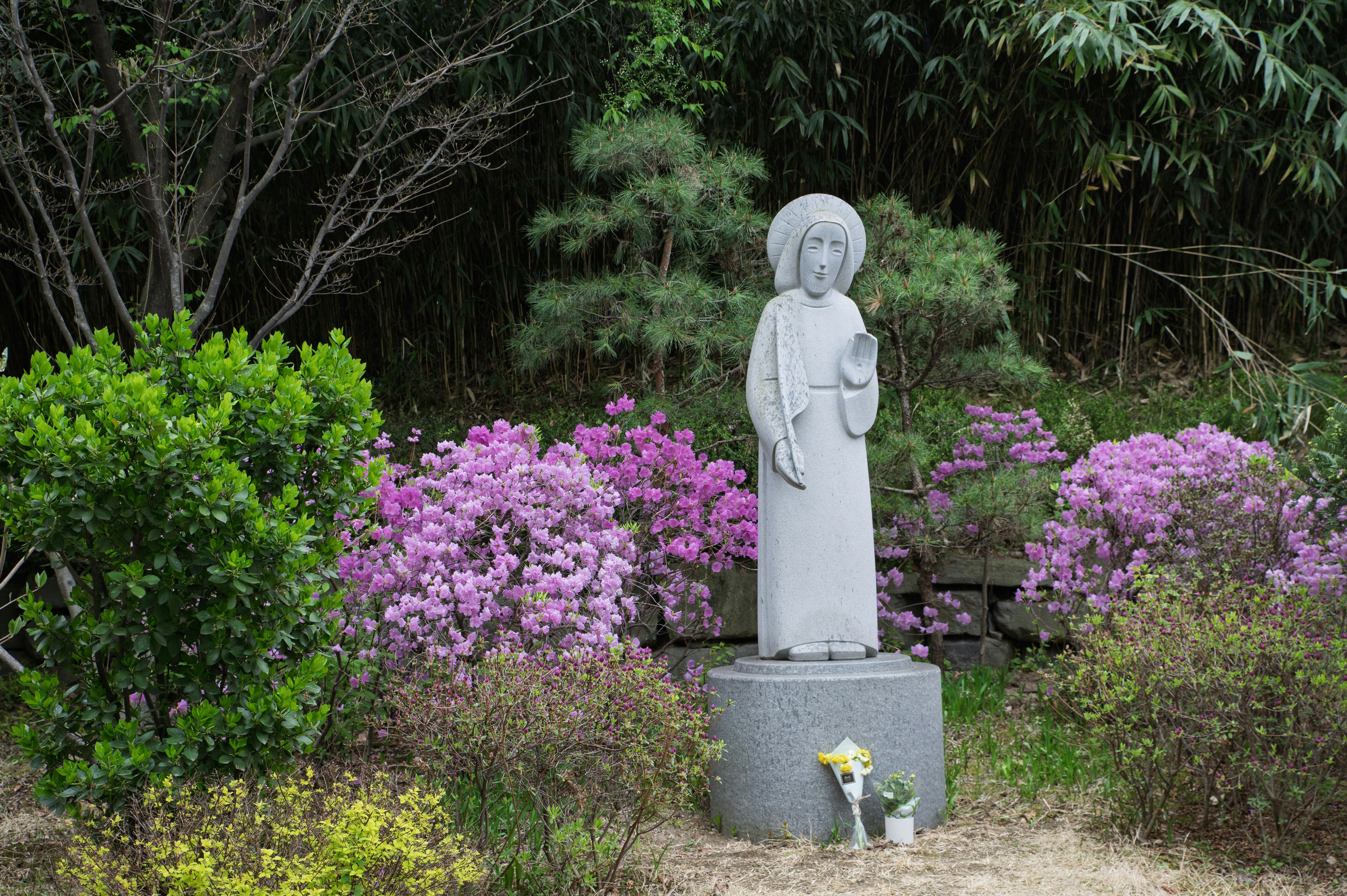 Stone Shrine in Bloom: A Quiet Garden Portrait