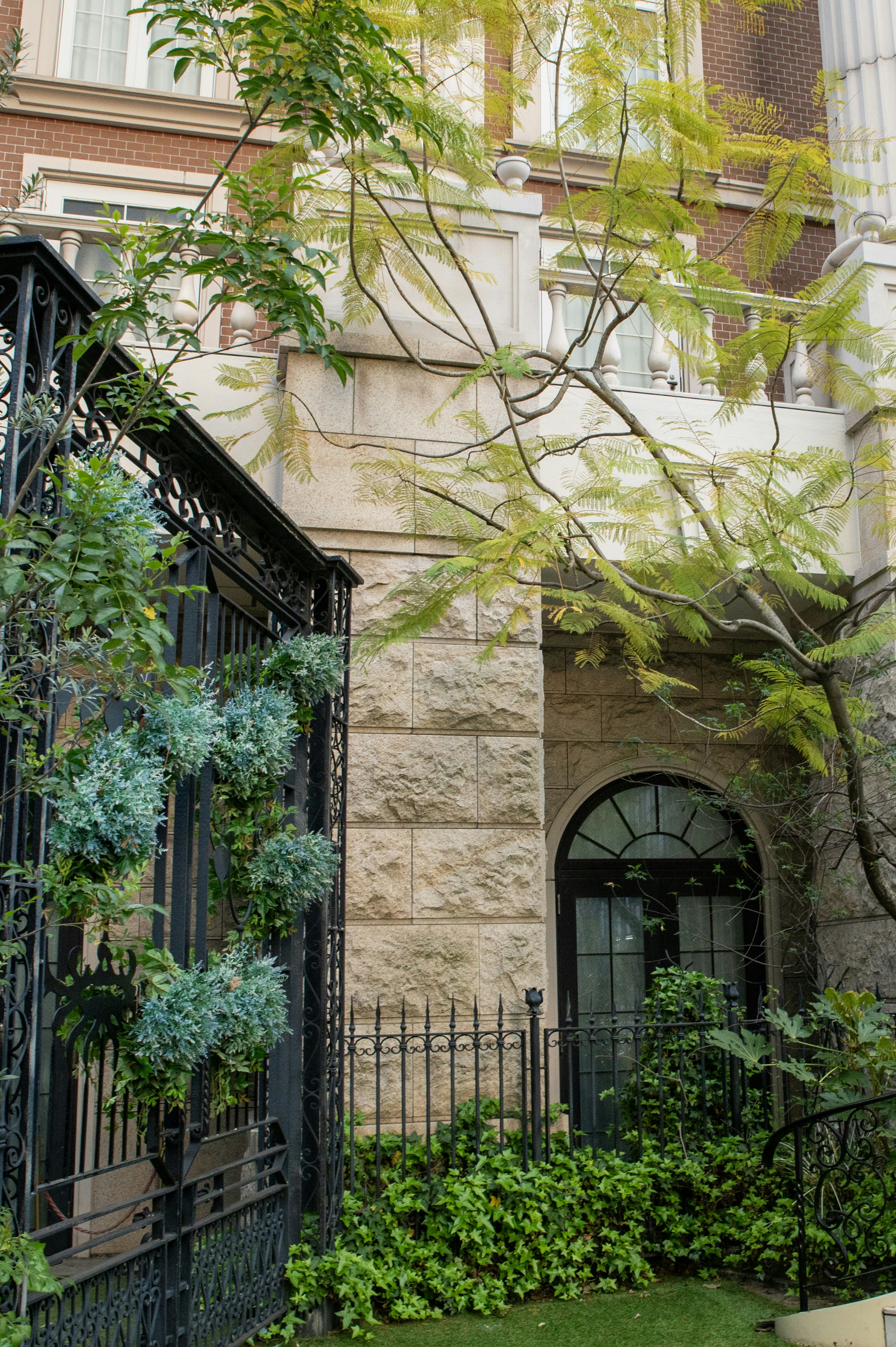 Verdant Archways and Historic Facade Enclosure