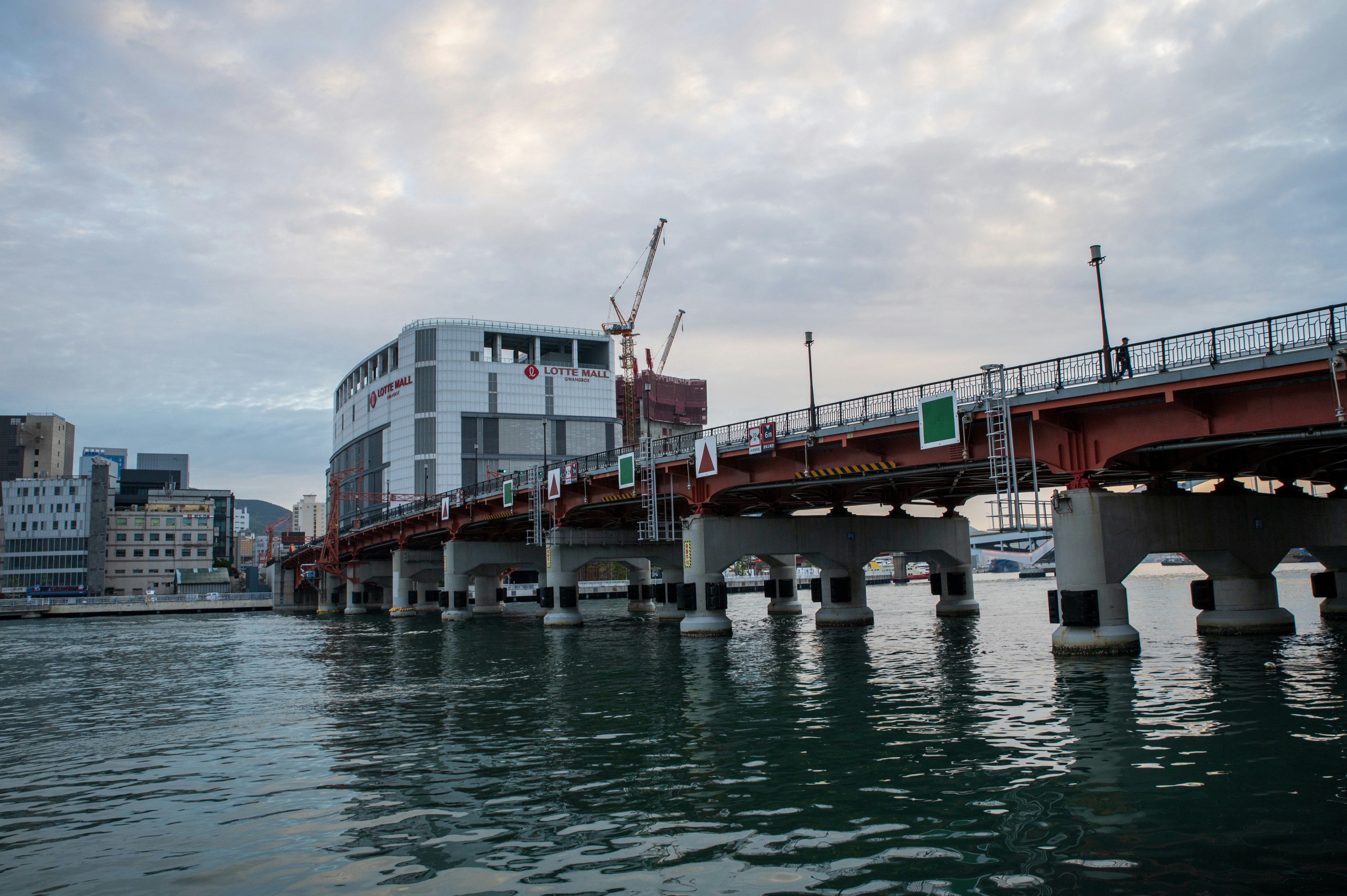 Red Pier Arc: A City Bridge Spanning Quiet Harbor