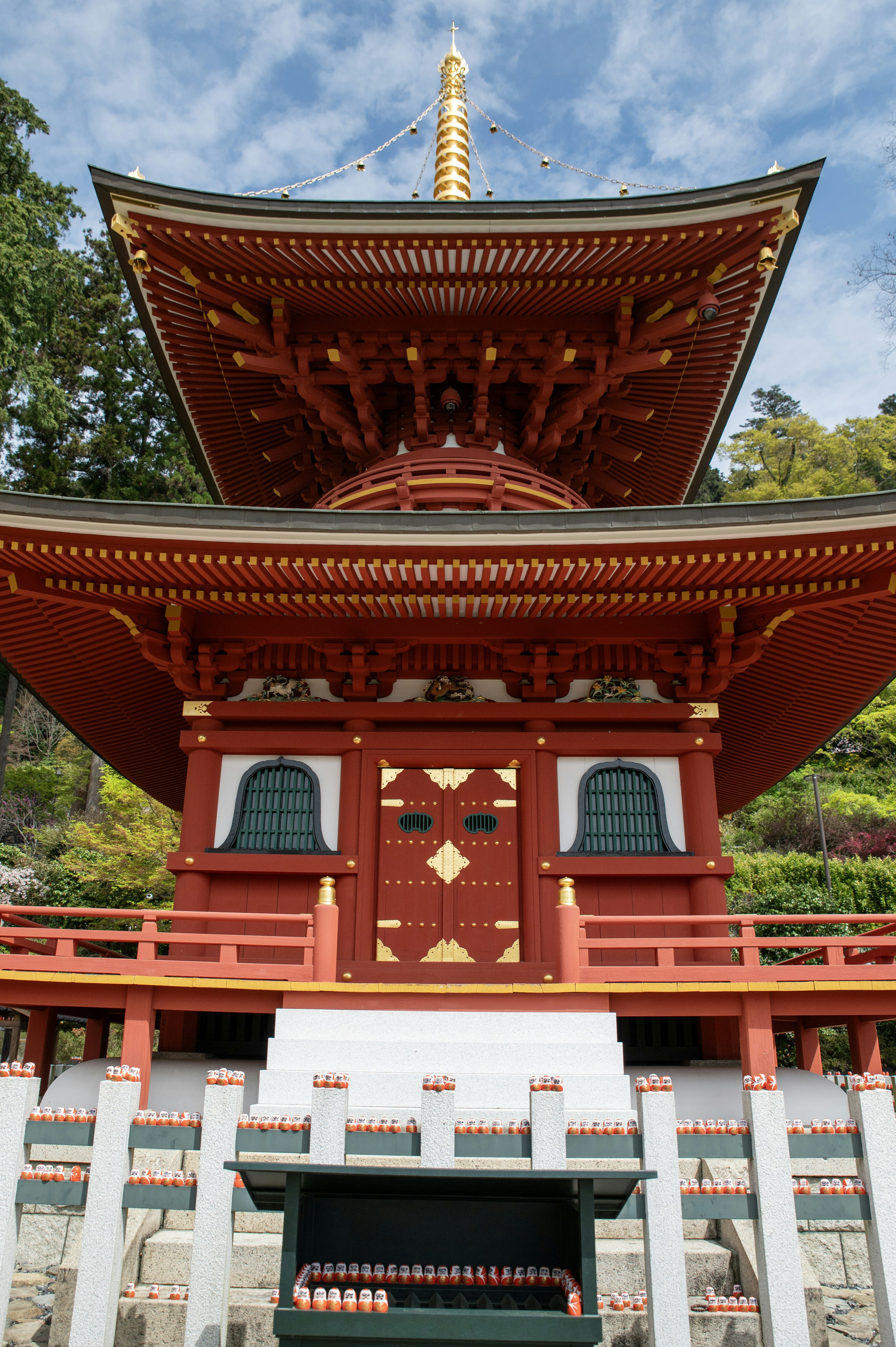 Crimson Zen: A Red Pagoda Reaches Toward a Clear Sky