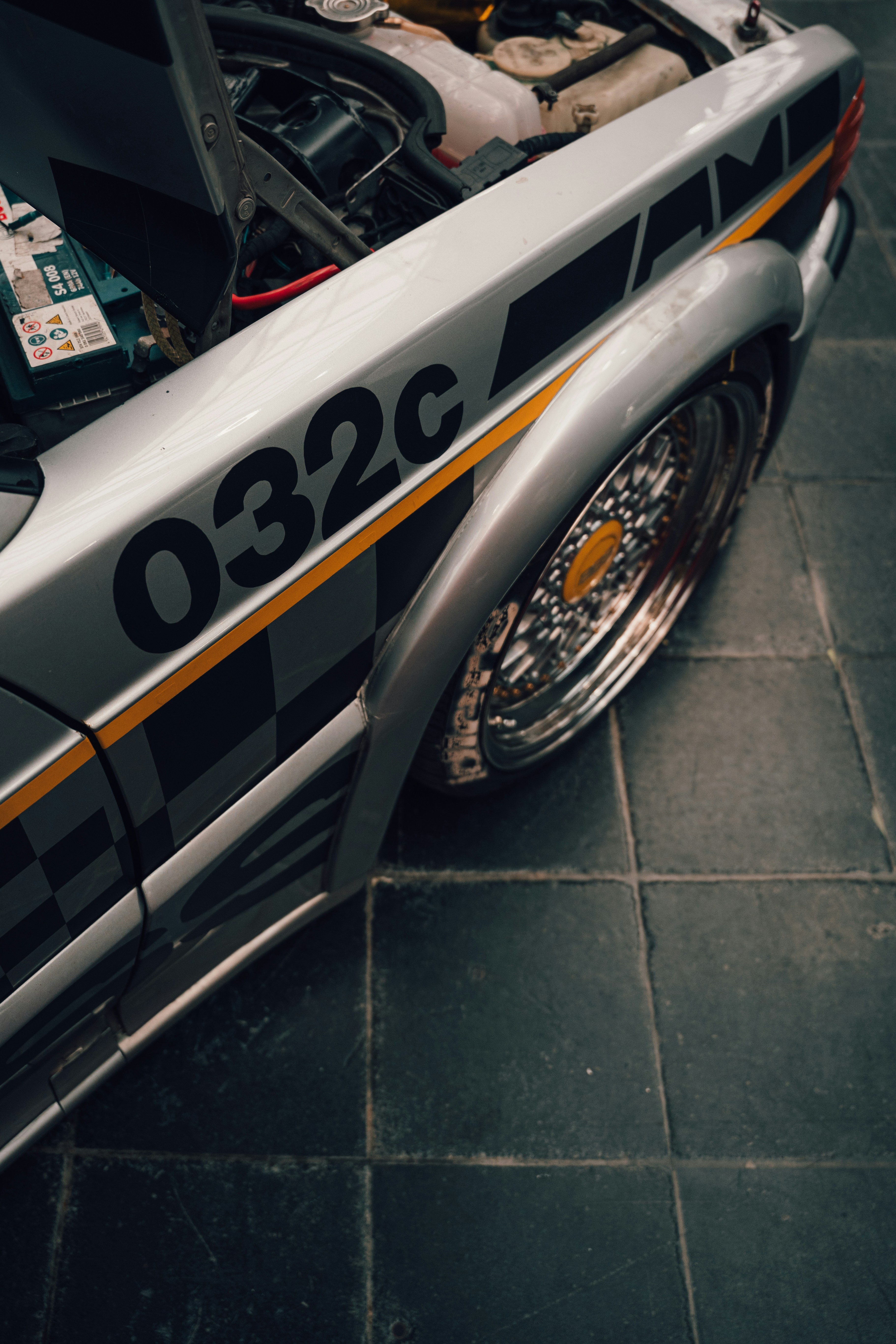 Silver Racing Accent: Close-Up of a Front Fender and Wheel