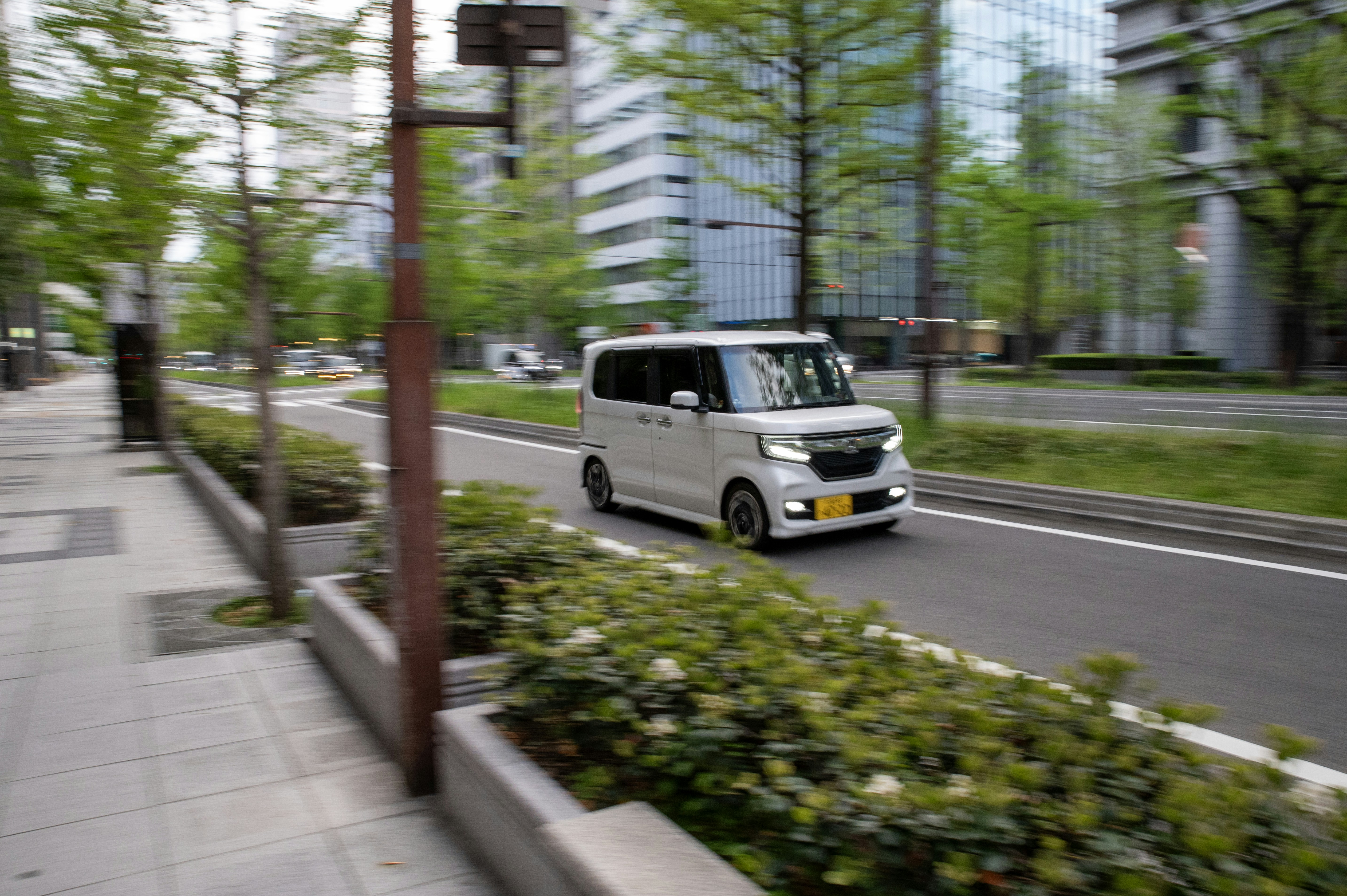 White Mini Van in Urban Motion Blur