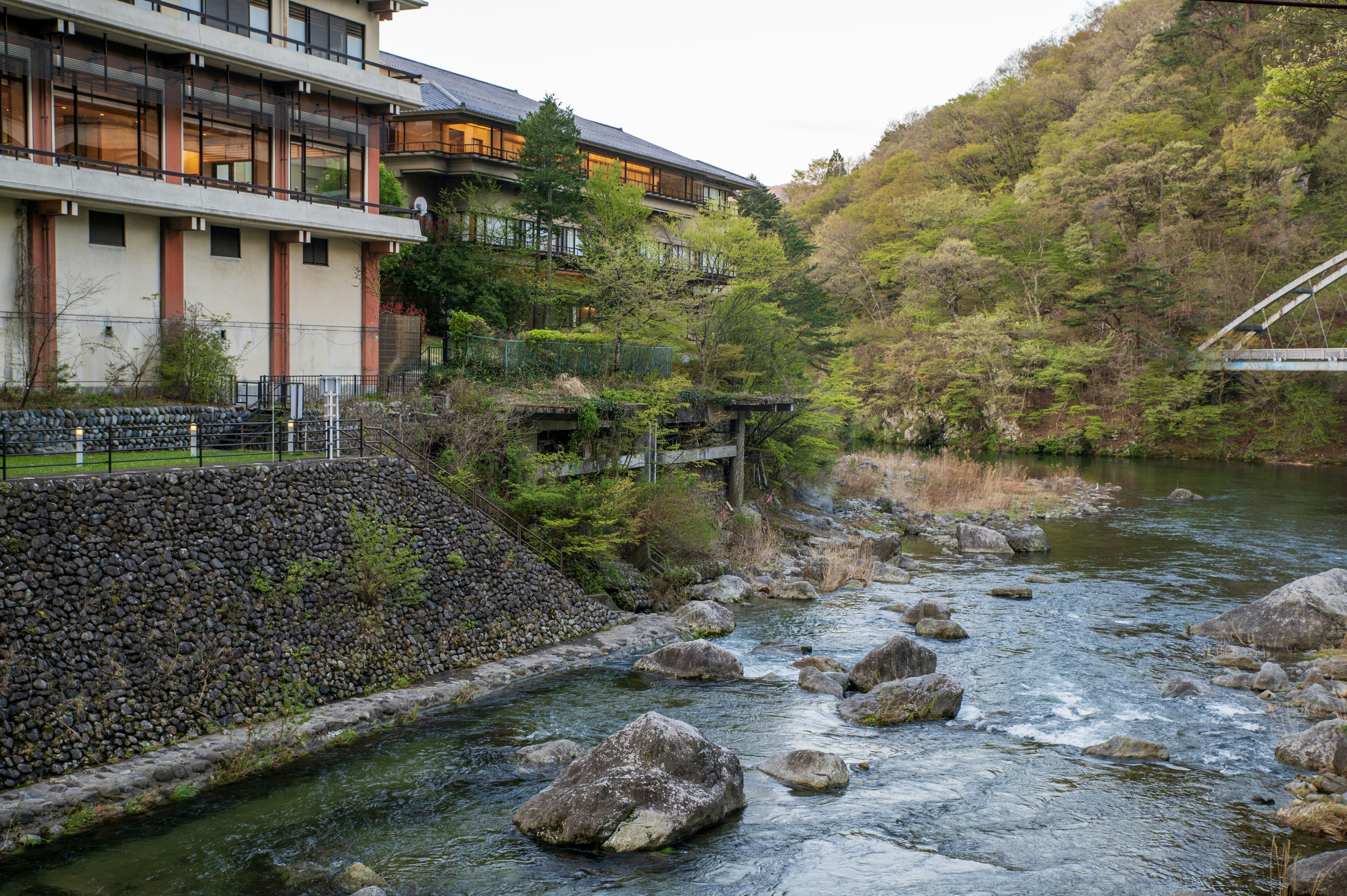 Waterside Onsen Retreat: Stone Terrace Overlooking a Quiet River