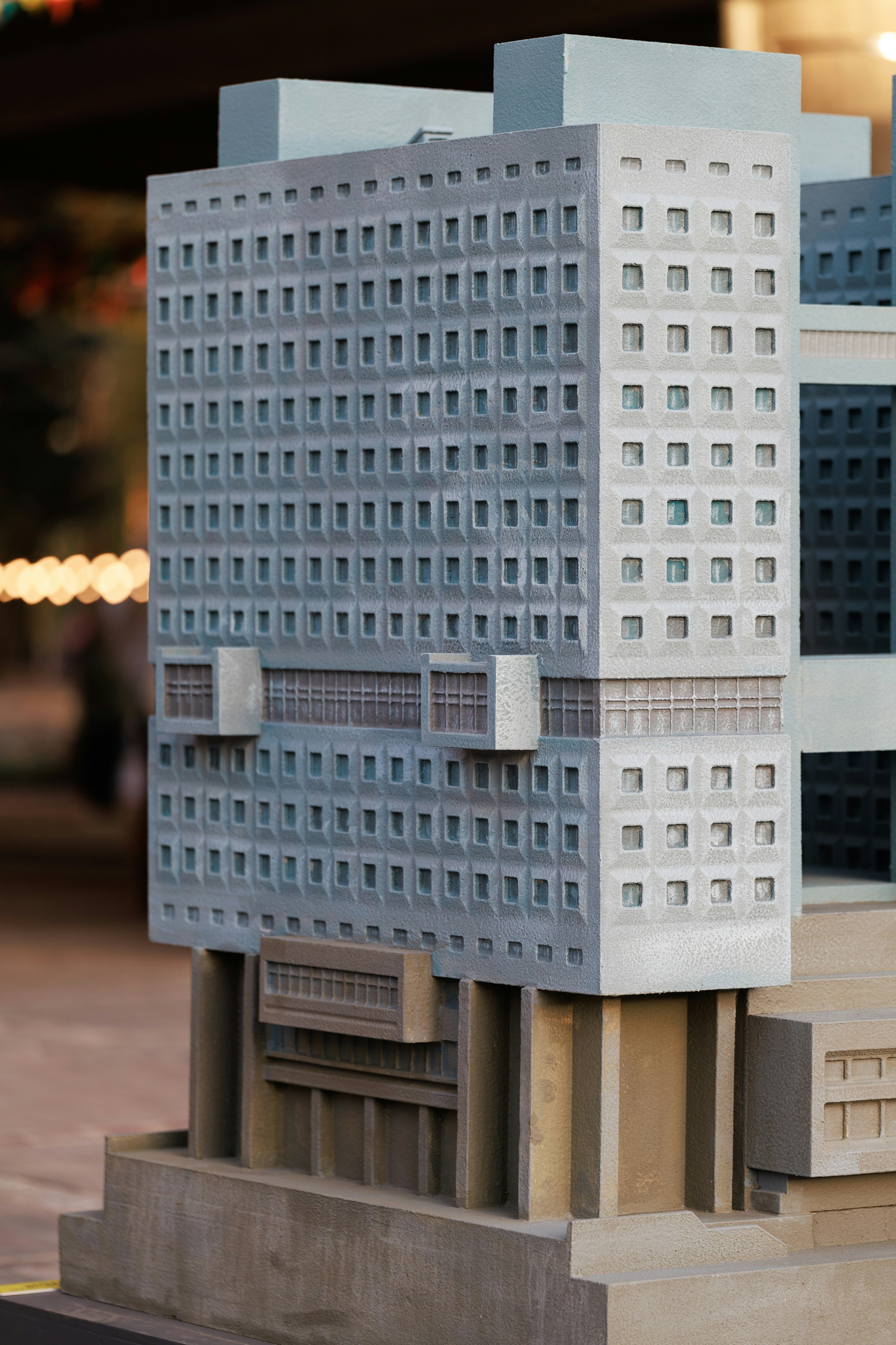 Miniature Office Tower: Concrete Microcosm in Focus