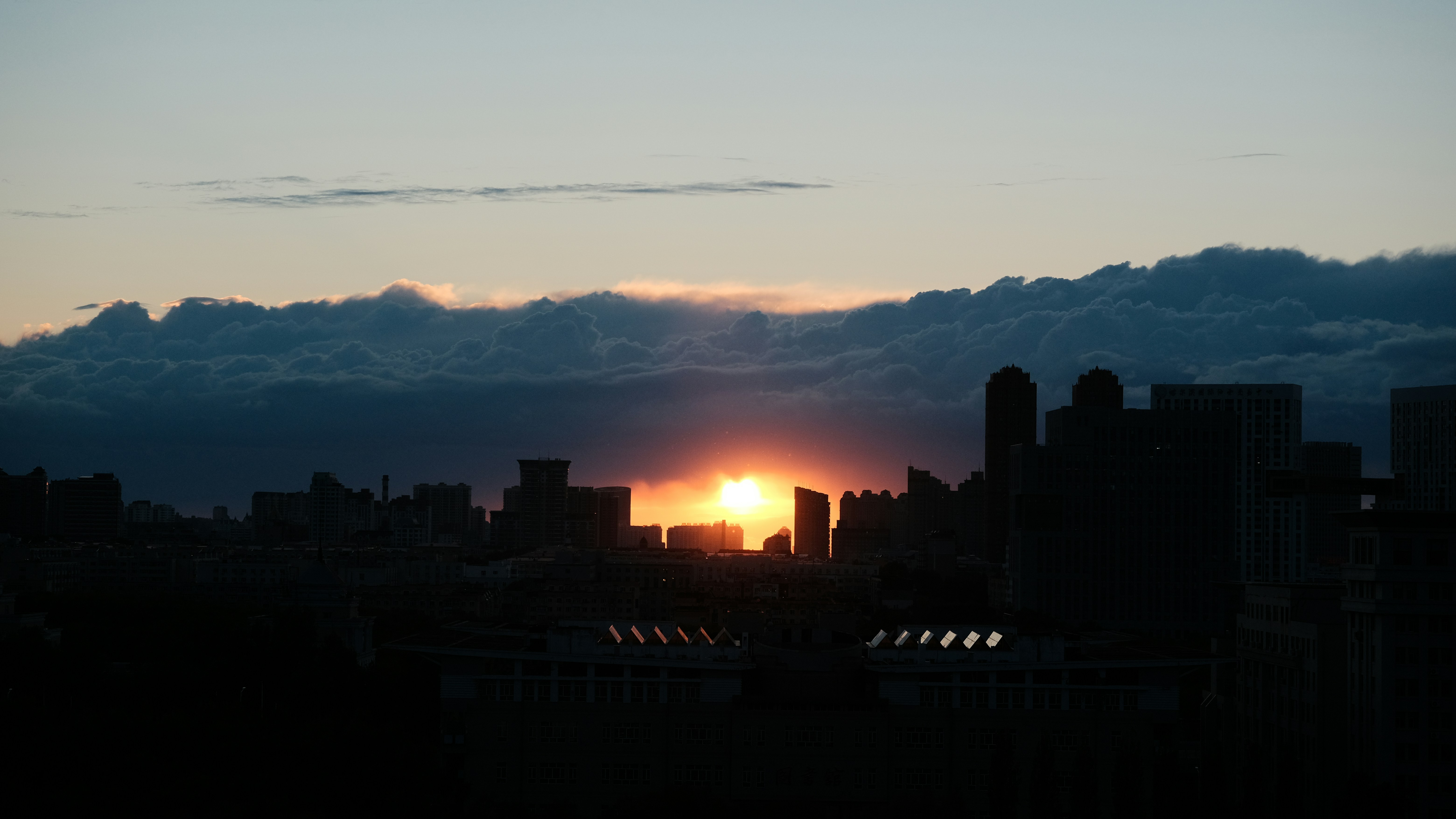 Sunrise Over a Dusk-Quiet Skyline