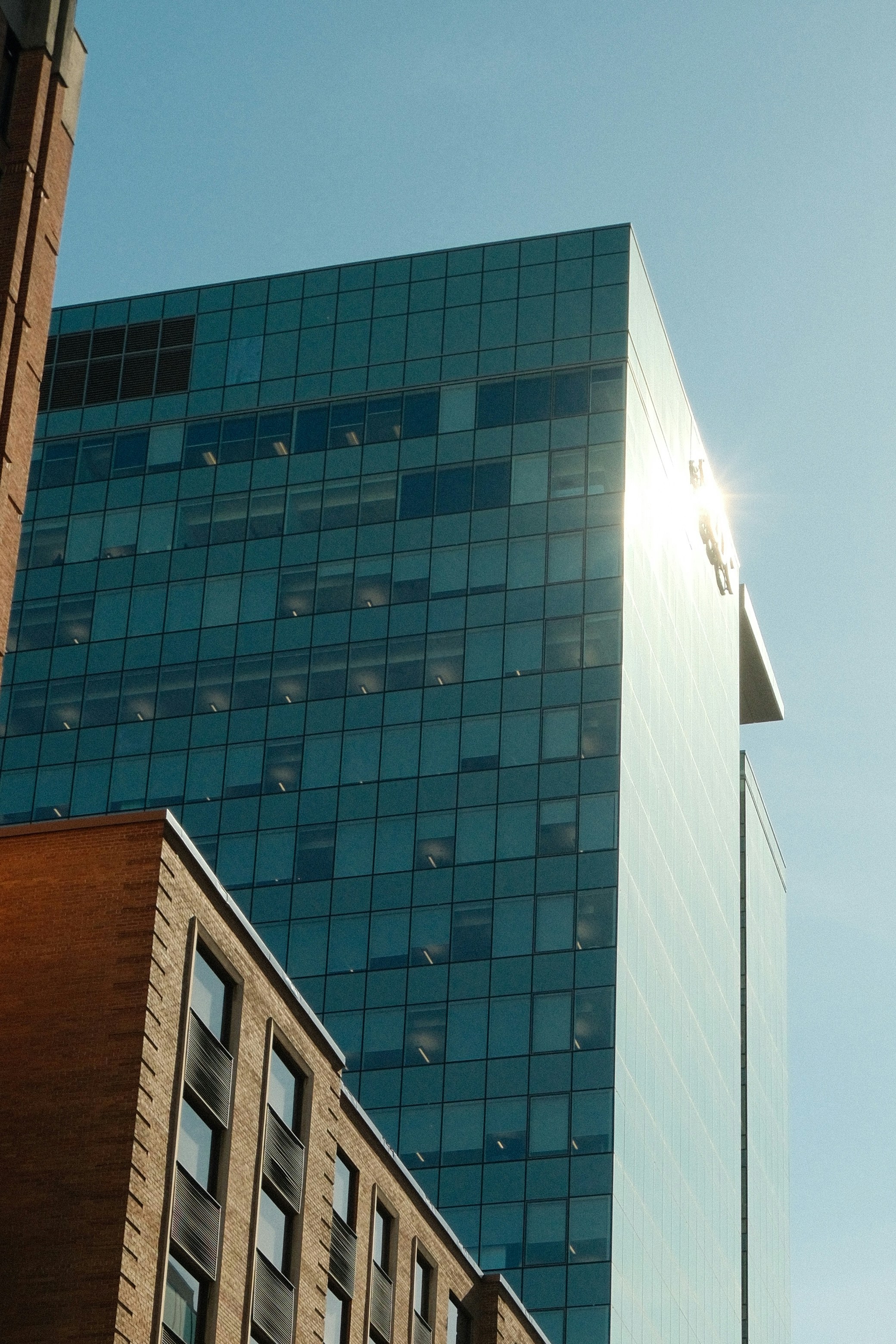 Skyward Glass: A Tower of Blue Reflections