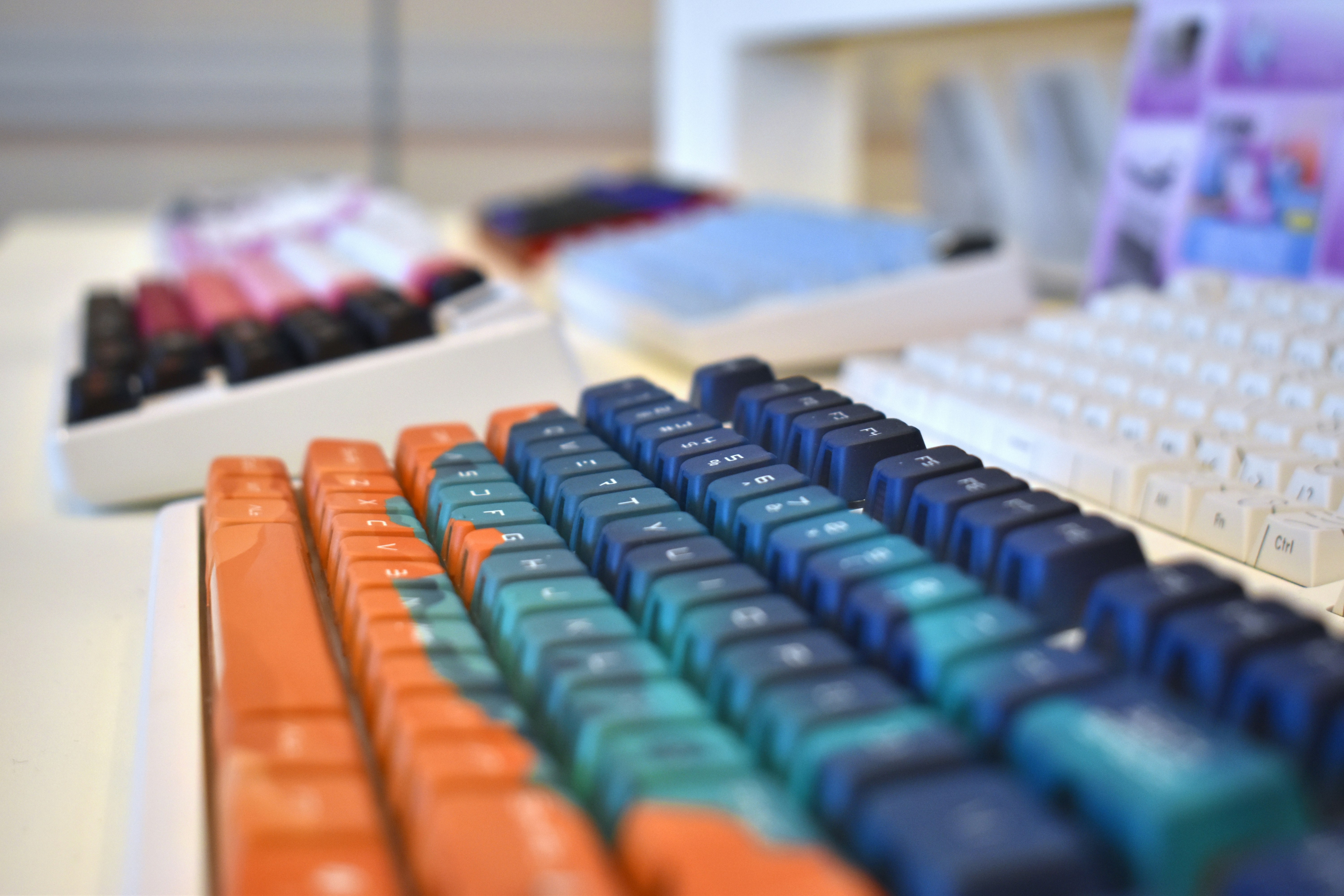 Colorful Row: A Close-Up of Rainbow Keycaps on a Curving Keyboard