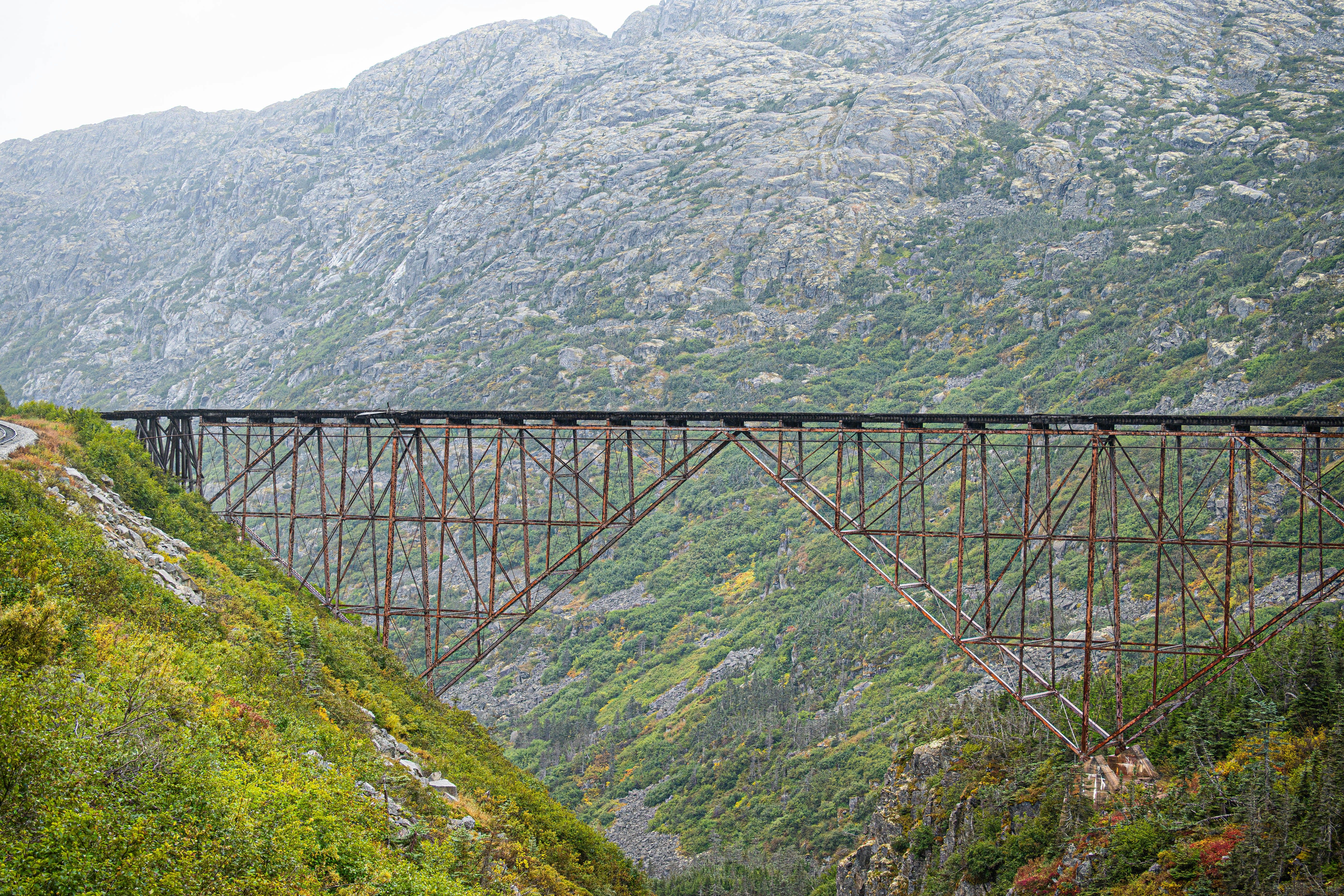 Ridge Bridge Crossing: A Steel Thread Spanning a Mountain Gorge