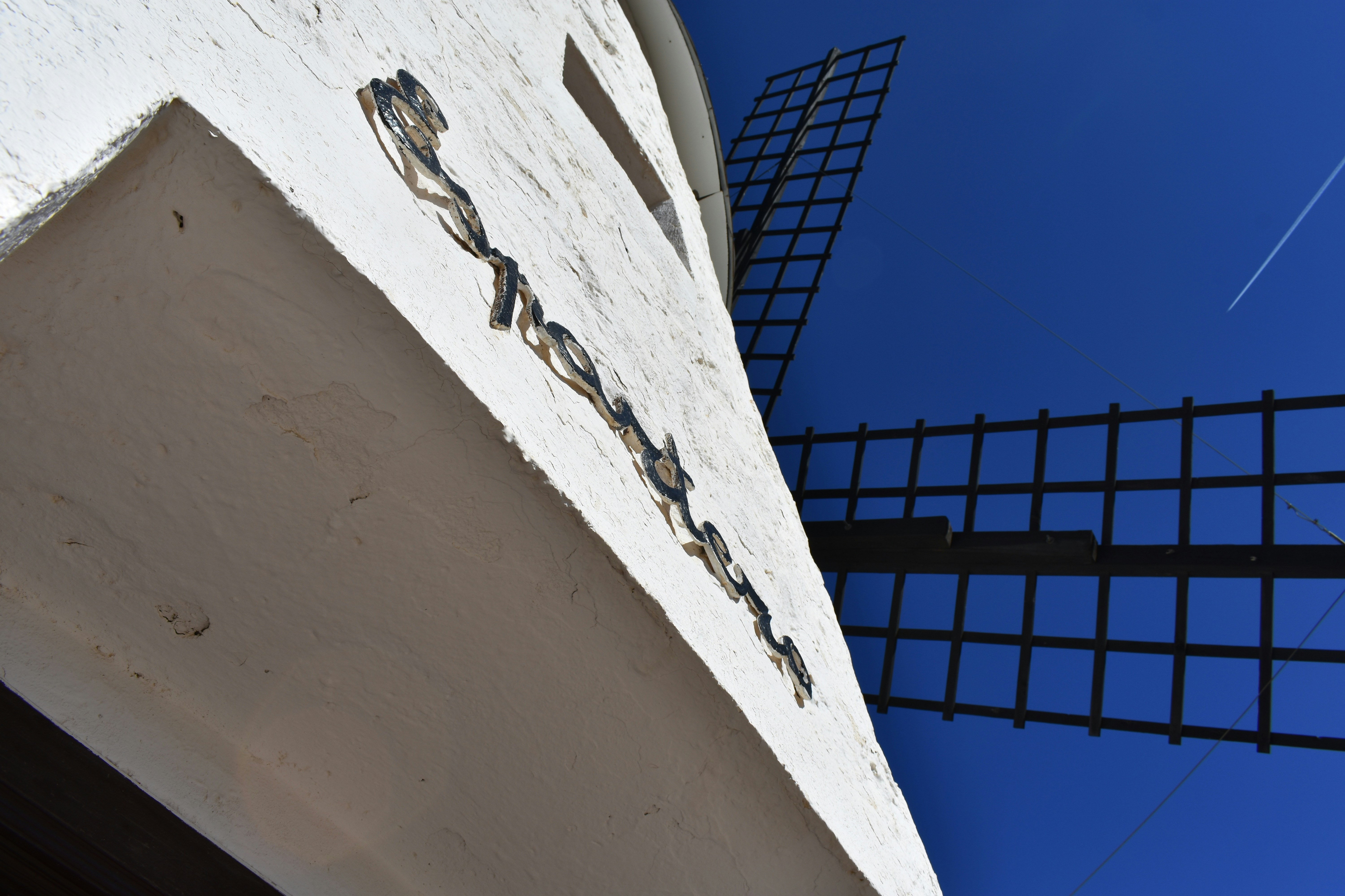 Whitewashed Windmill Corner Reaching Toward a Deep Blue Sky