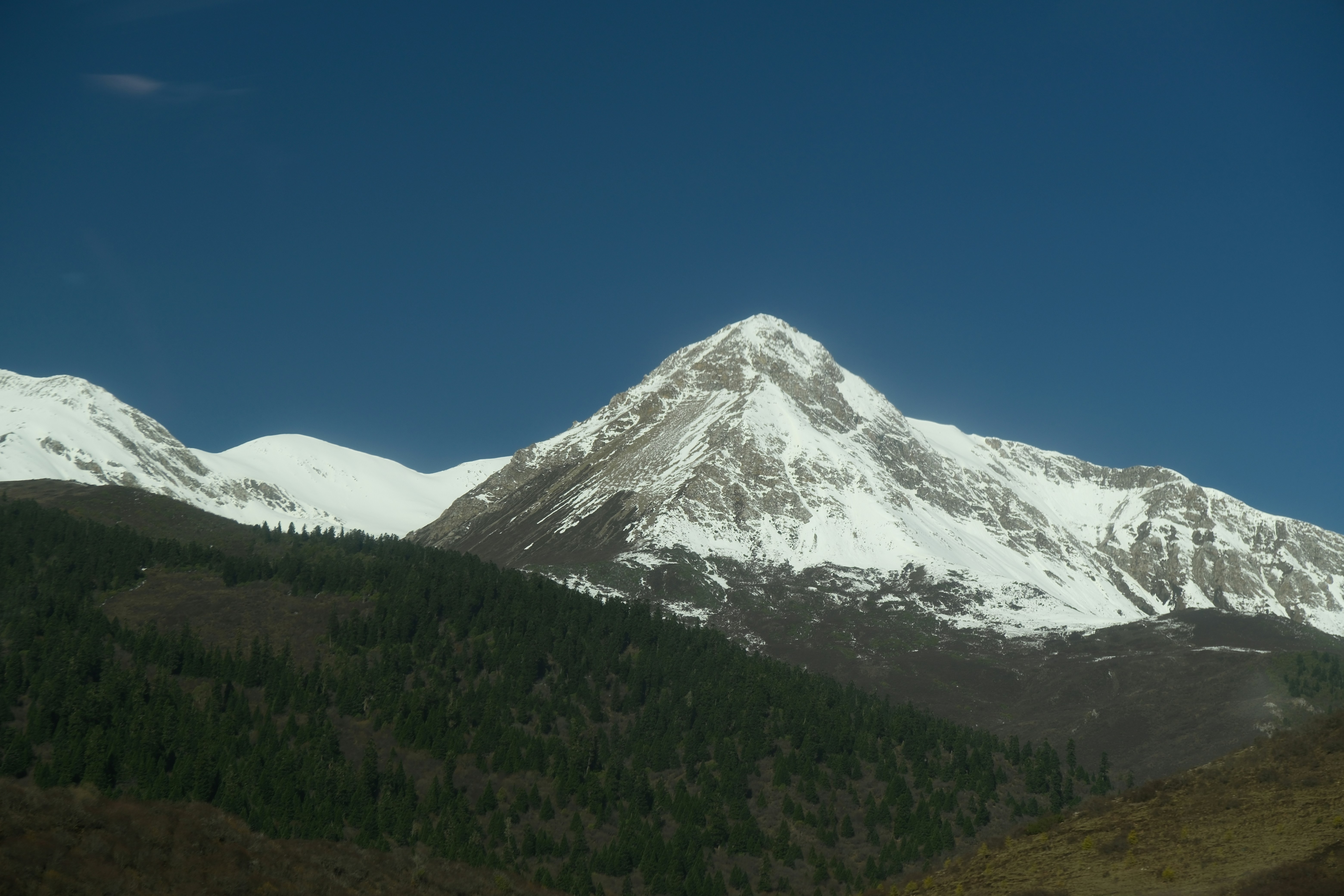 Snow-Capped Peak Under a Clear Alpine Sky
