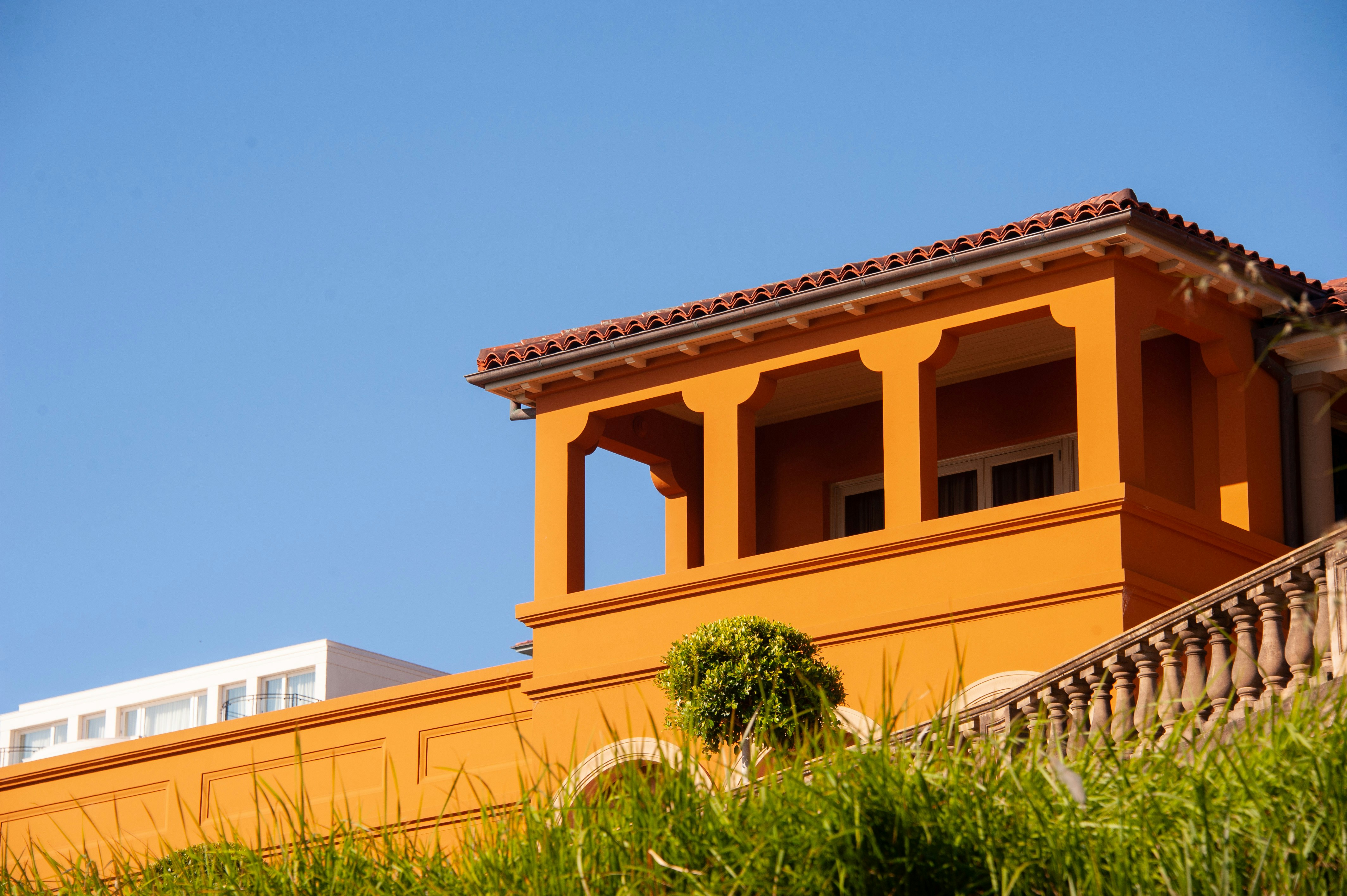 Sunlit Orange Terrace: A Villa Bathed in Golden Hue