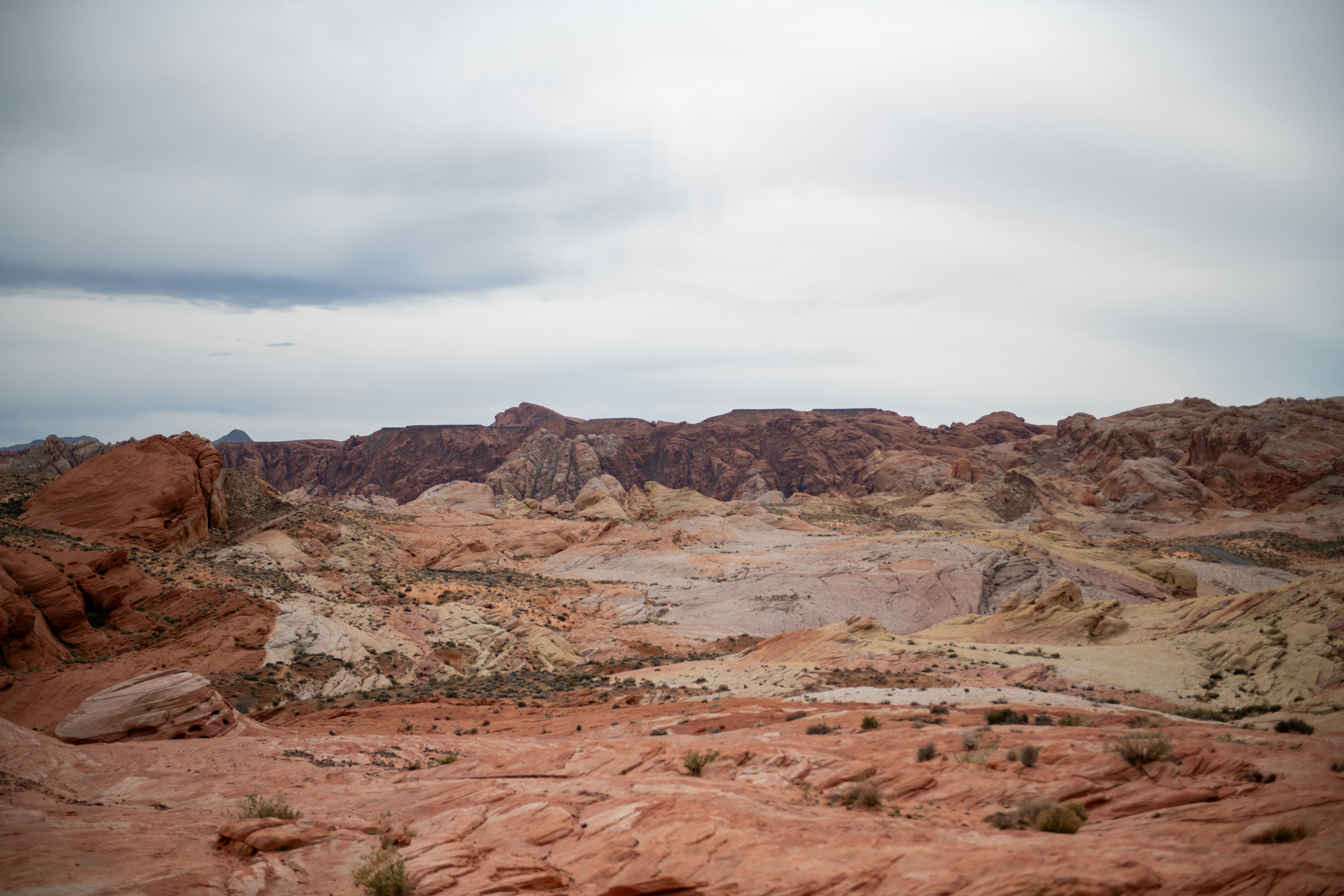 Red Plateau Echoes: A Quiet Sundown over Desert Formations