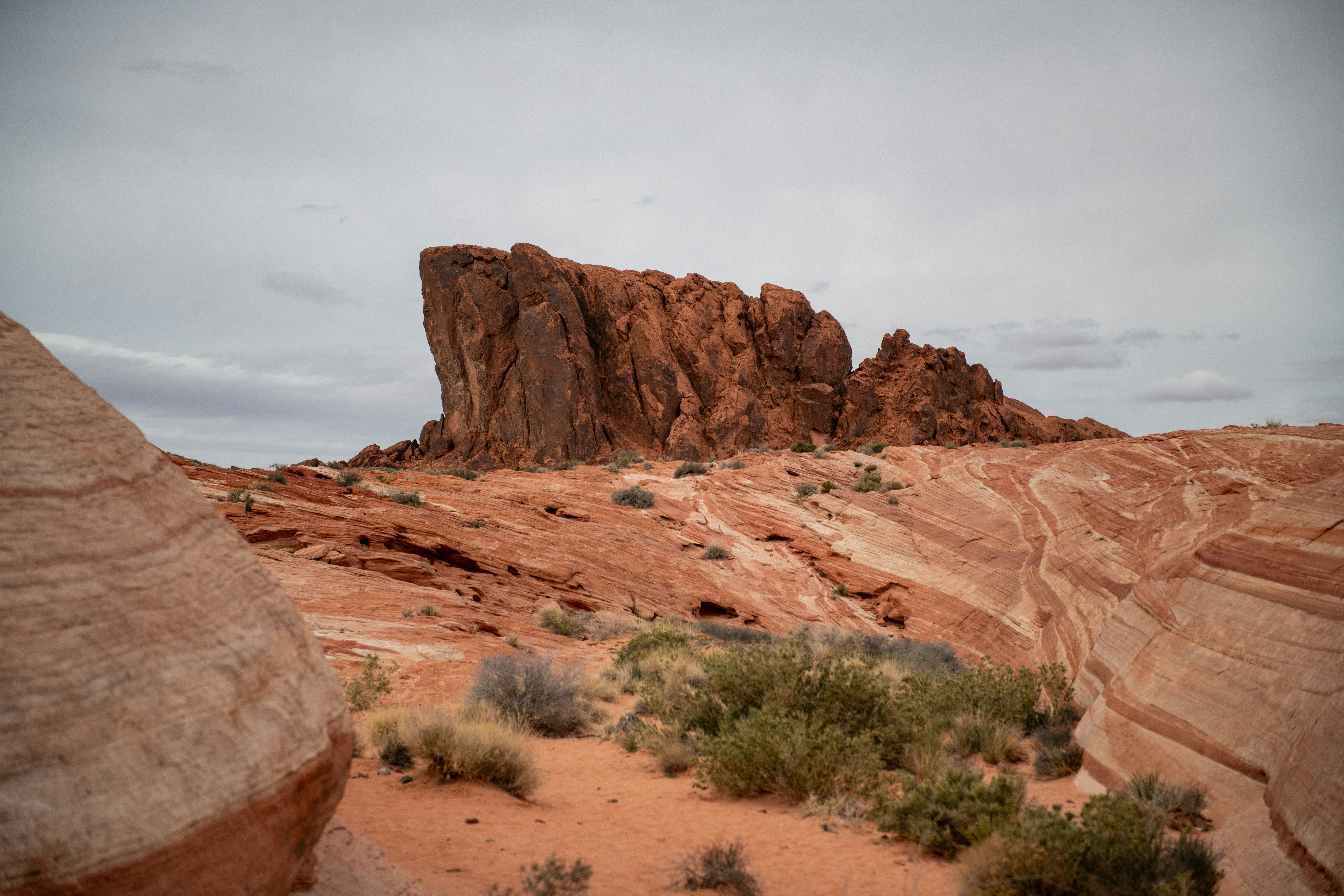 Red Ridge Sentinel: A Desert Monument Rising from Weathered Sand