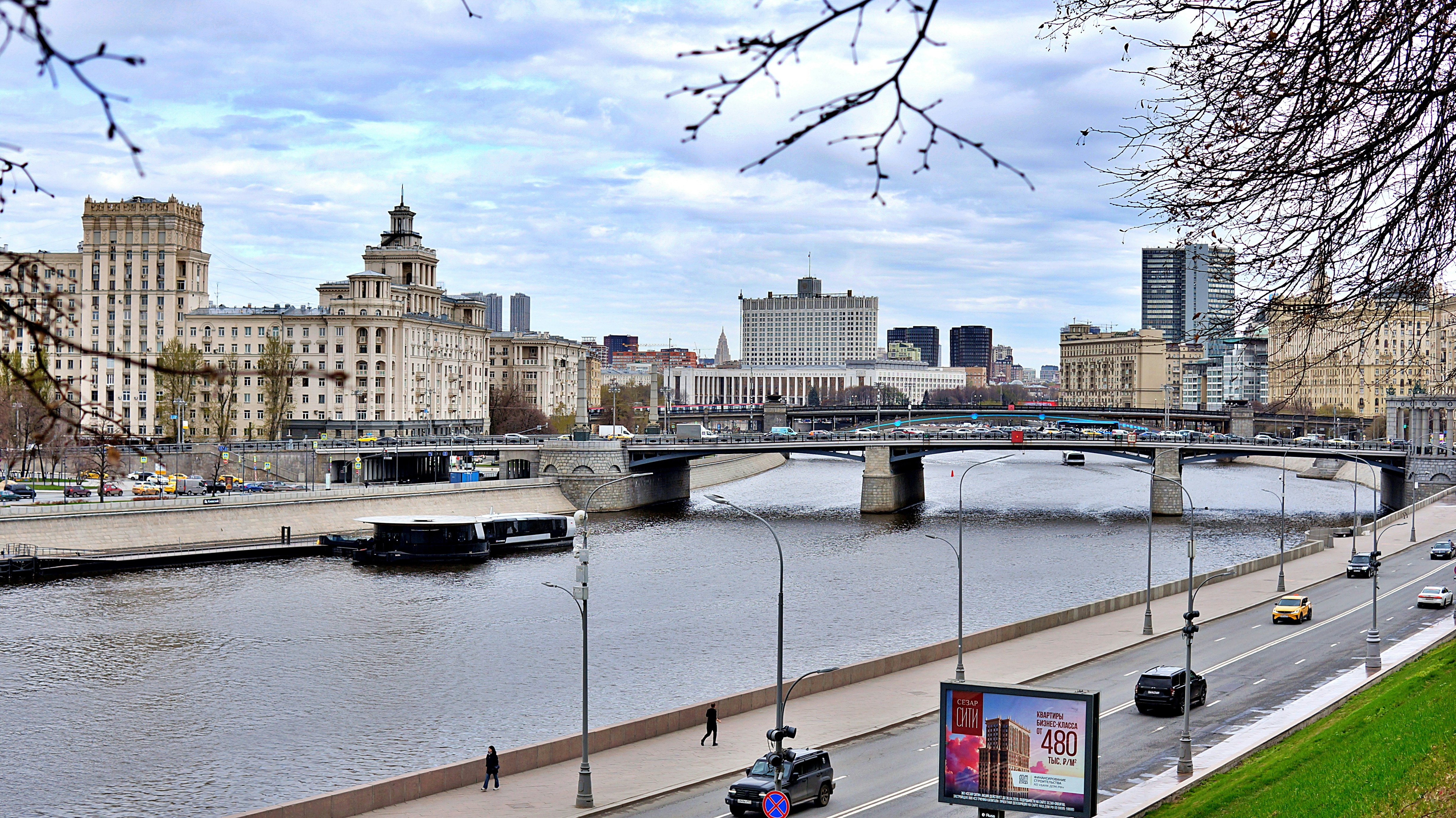 Embankment Along the River: Bridges, Boats, and Skyline
