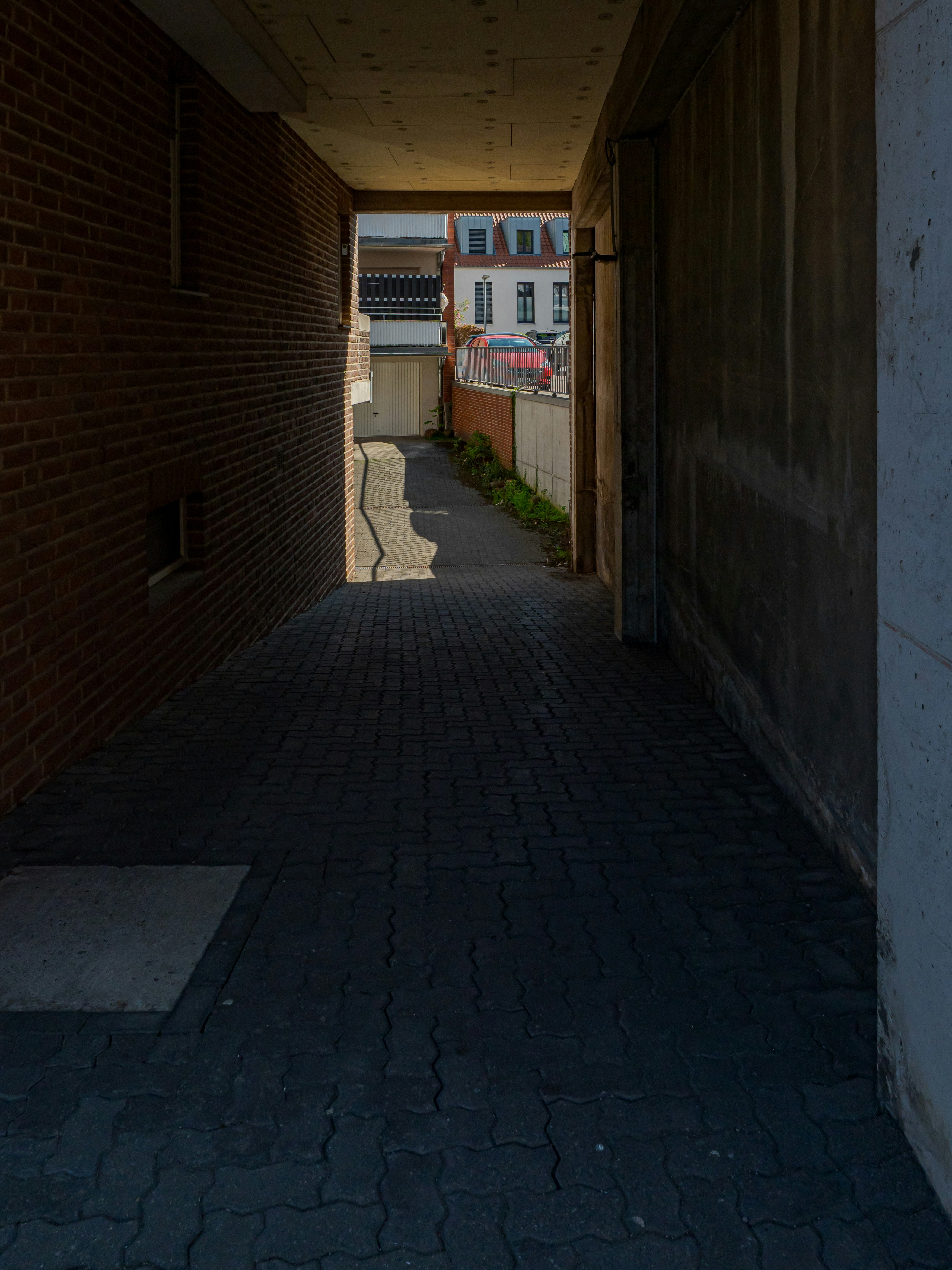 Through the Quiet Corridor to the Sunlit Street
