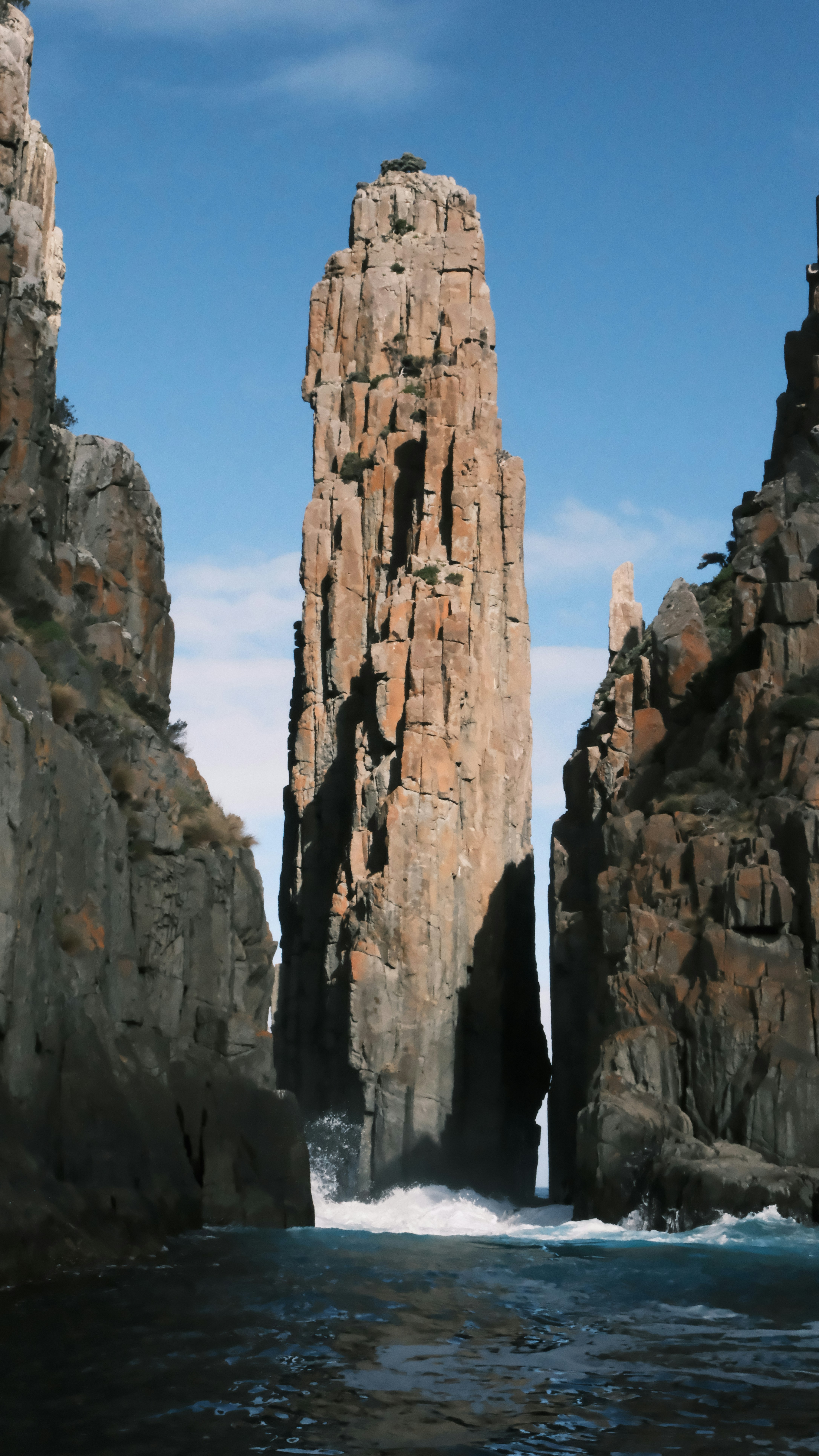 Sea Stack Sentinel: A solitary basalt pinnacle rising between tempest-tossed cliffs