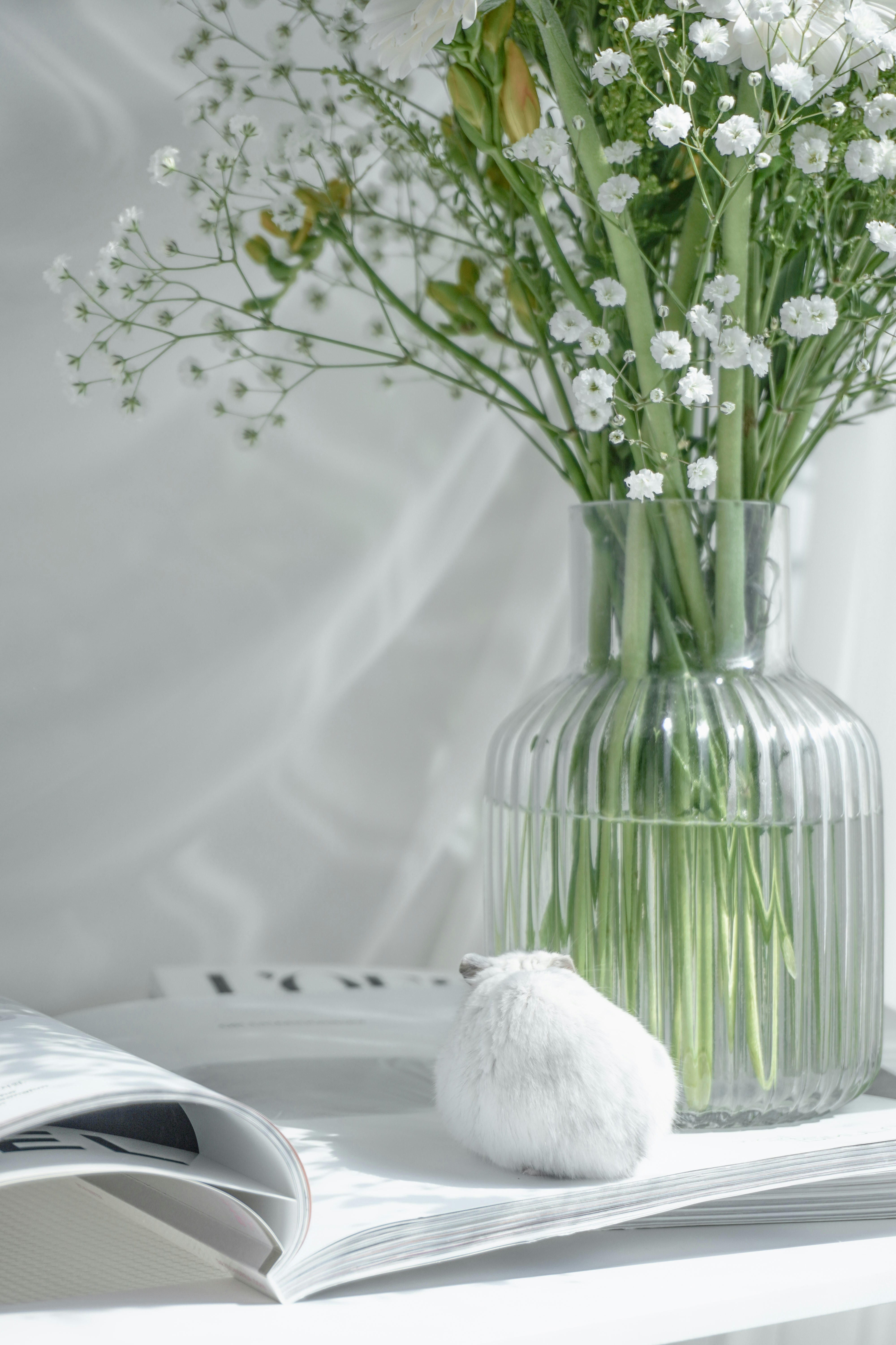 Elegance in Glass: White Florals in a Ribbed Vase