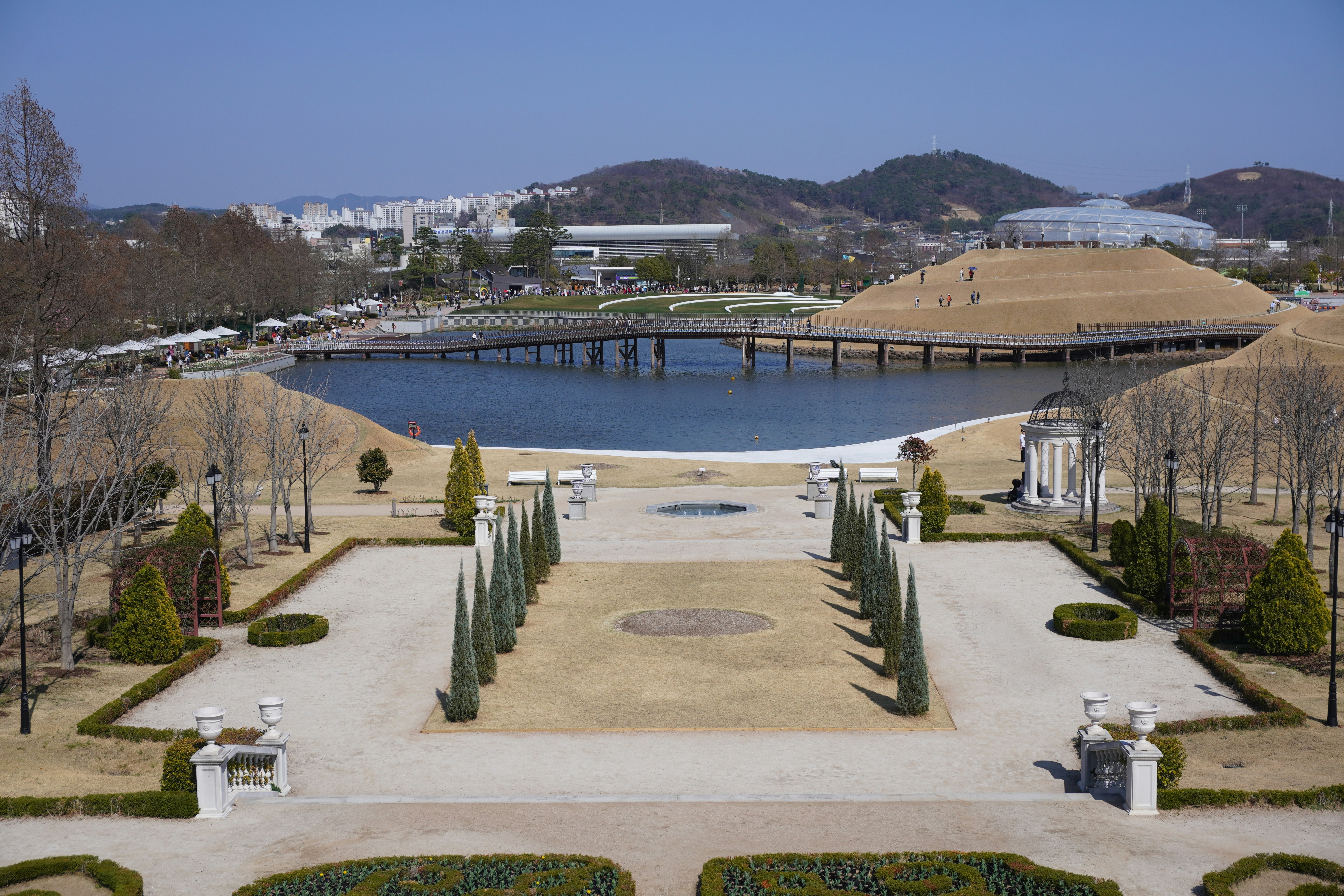Symmetrical Terraced Garden Leading to a Serene Riverfront